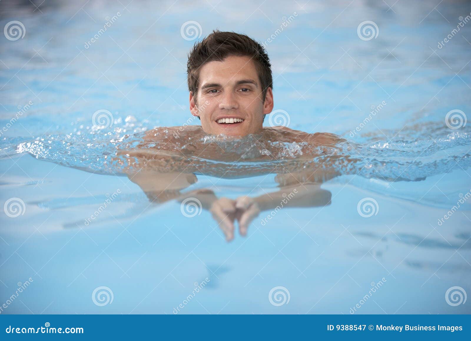 Young Man Swimming in Pool stock image. Image of enjoying - 9388547