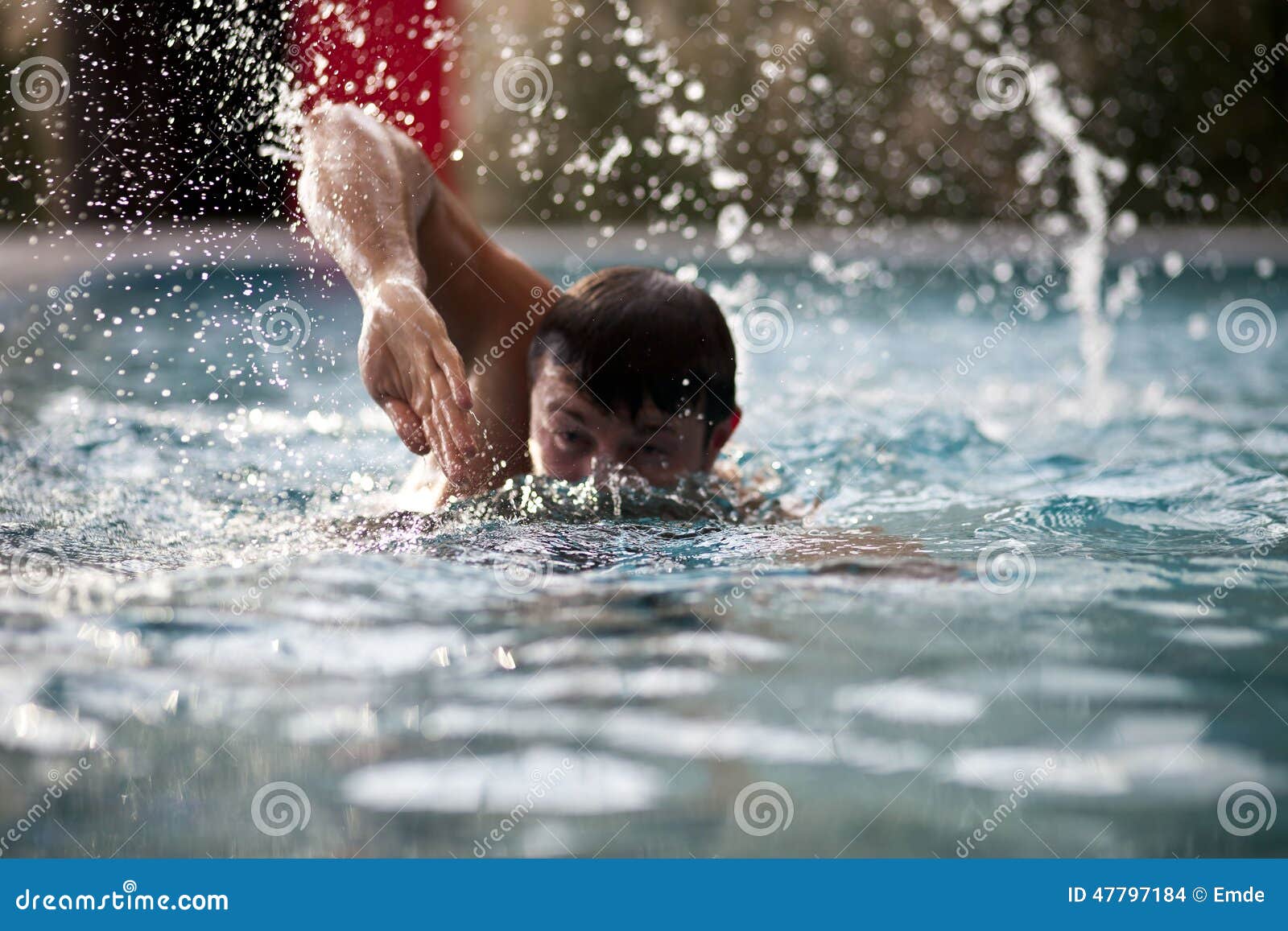 Young Man Swimming in Pool stock photo. Image of activity - 47797184