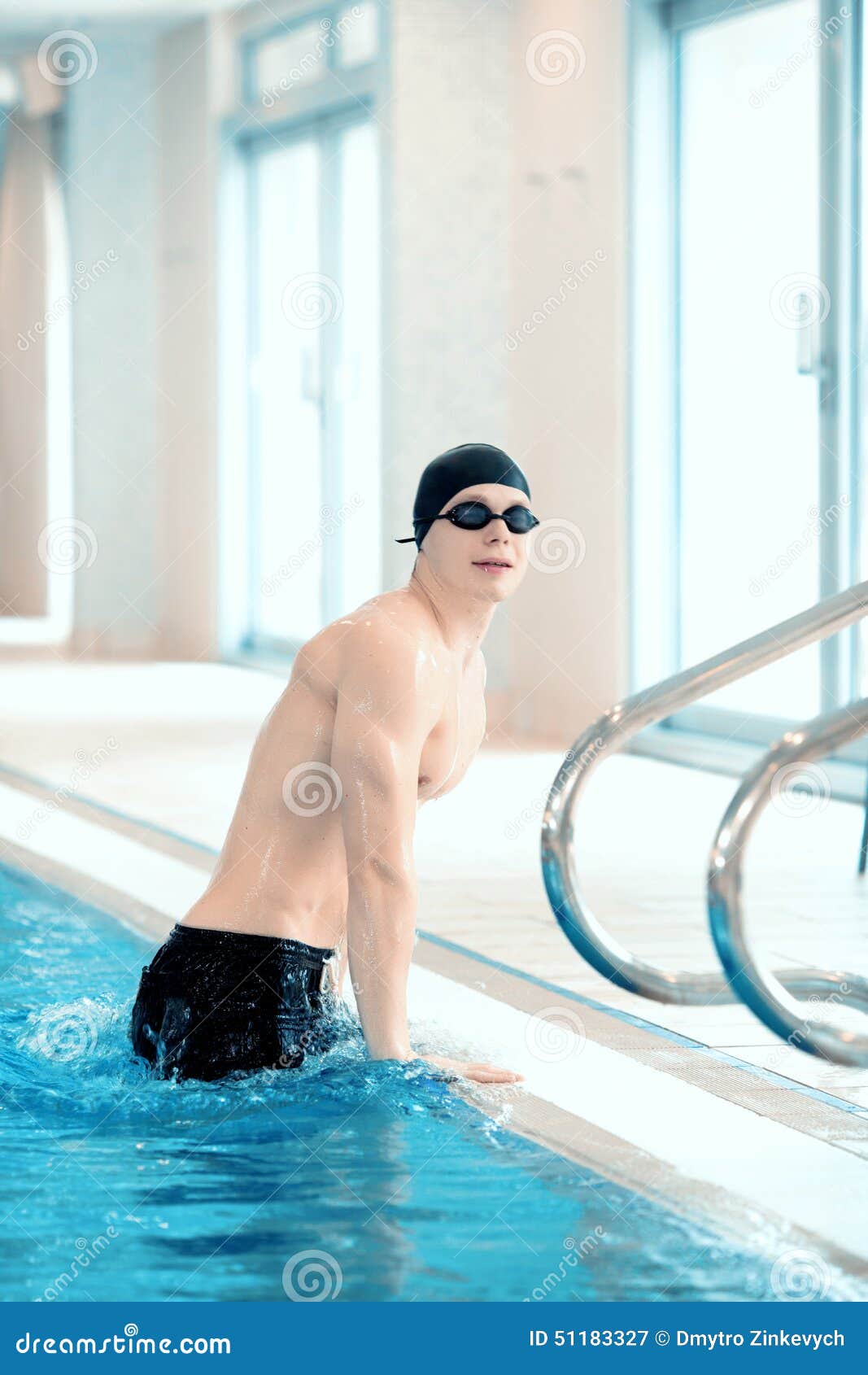 Young man in swimming pool stock image. Image of front - 51183327
