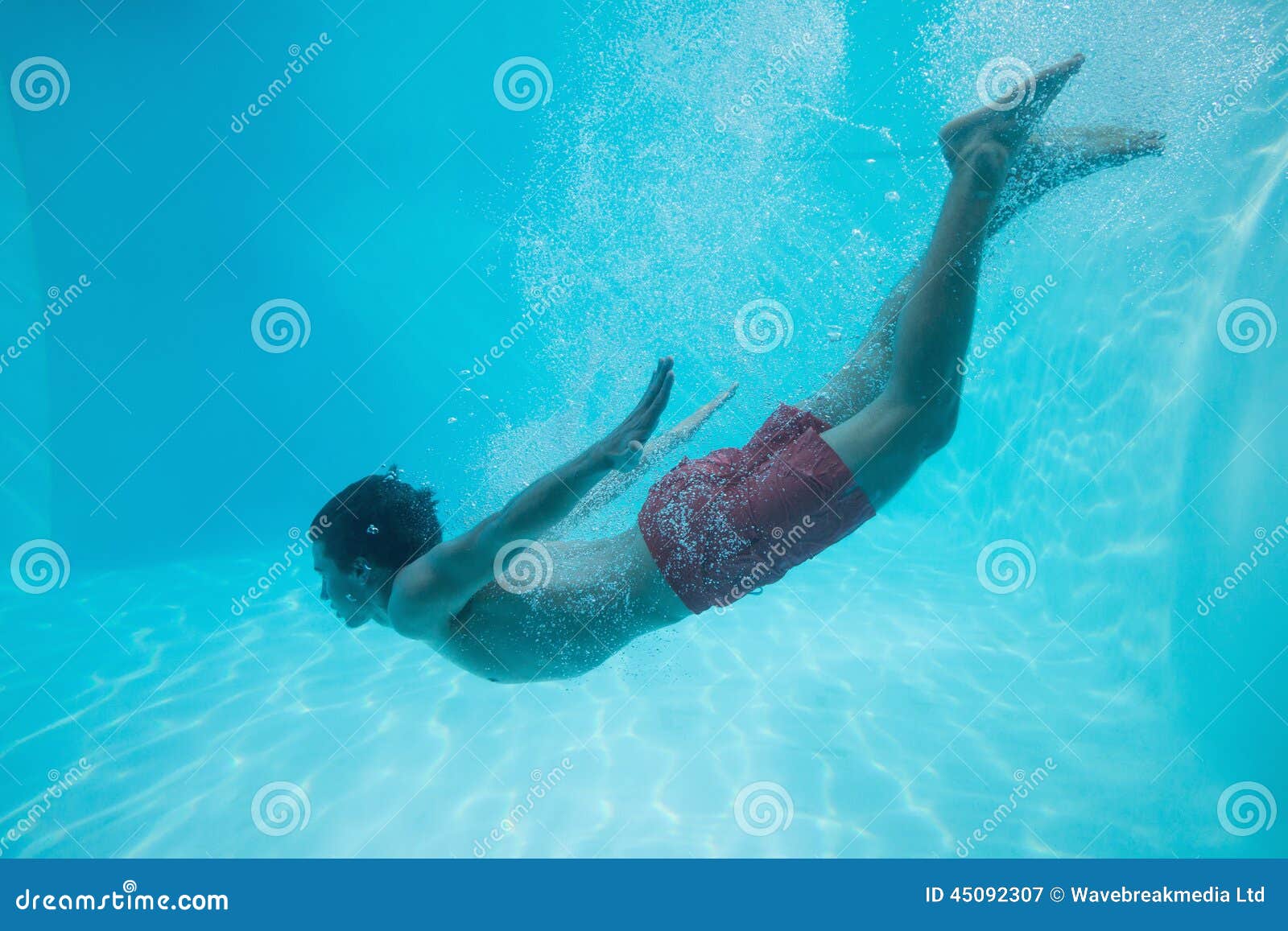 Person Swimming Underwater Side View