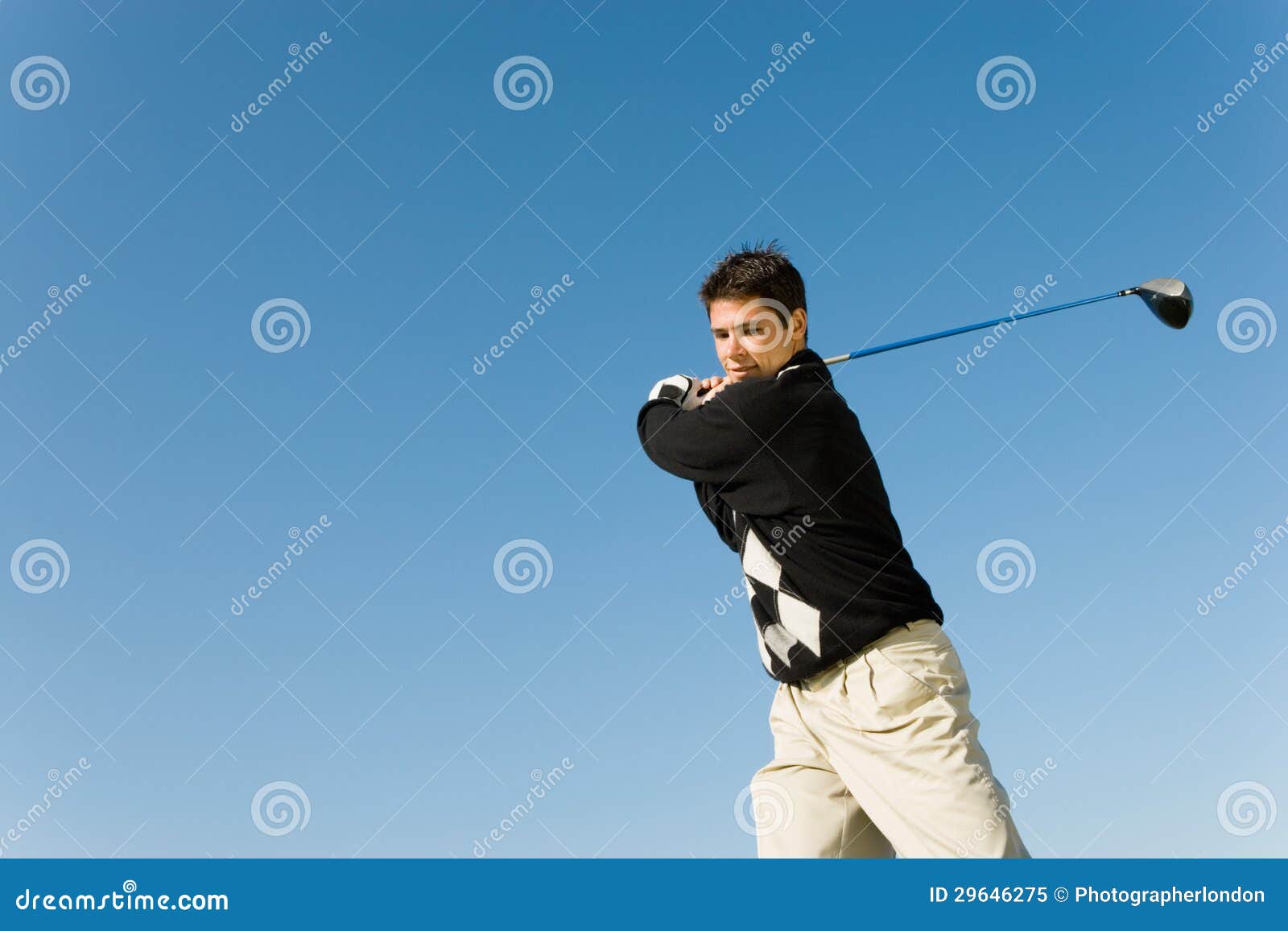 Young Man Swinging Golf Club Stock Image - Image of blue, male: 29646275