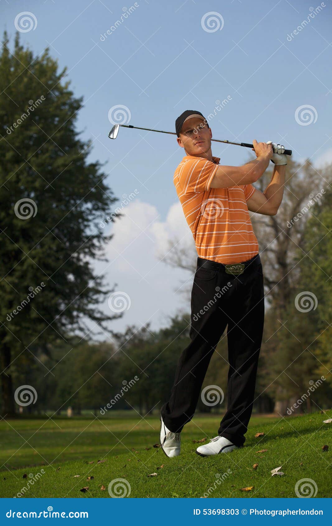 Young Man Swinging Golf Club Stock Image - Image of person, full: 53698303