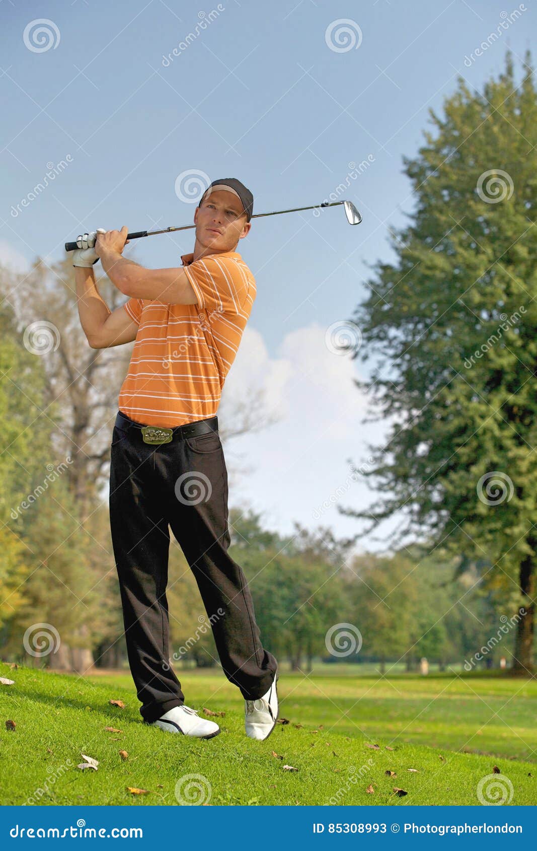 Young Man Swinging Golf Club Stock Image - Image of hobbies ...