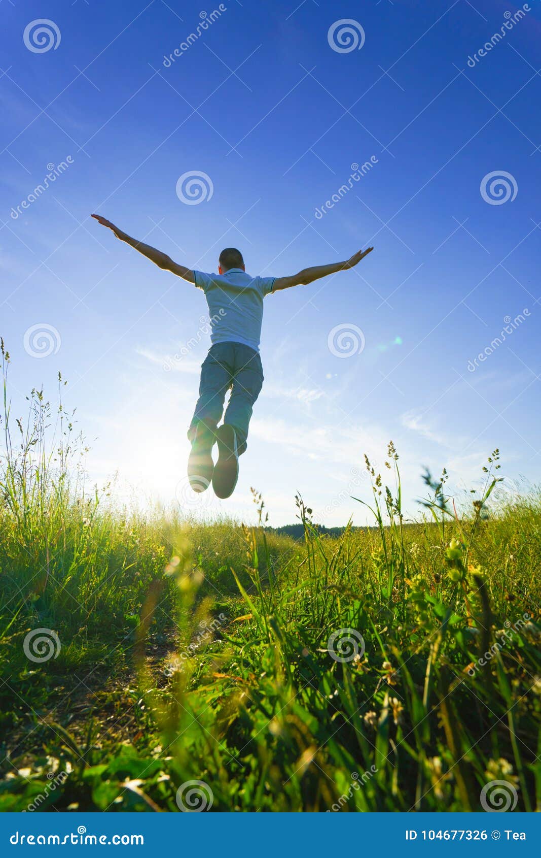 Young man take off stock photo. Image of lifestyle, meadow - 104677326