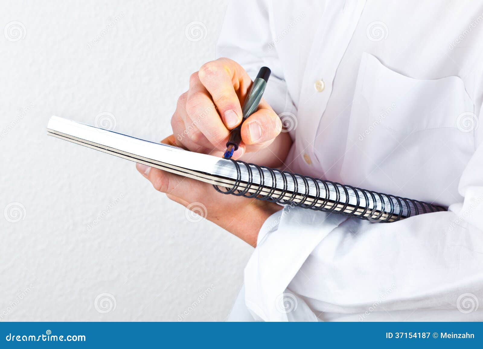 Young man takes notes stock image. Image of macro, office - 37154187