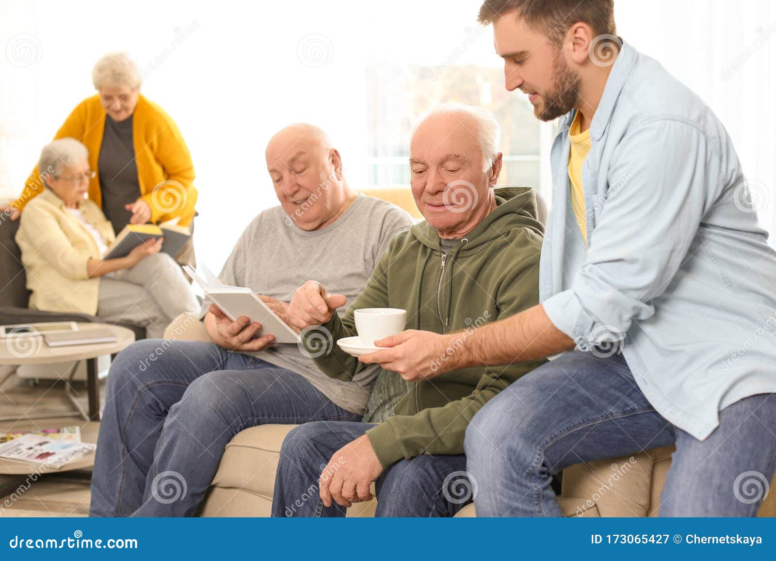 Young Man Taking Care of Elderly People in Hospice Stock Image - Image ...