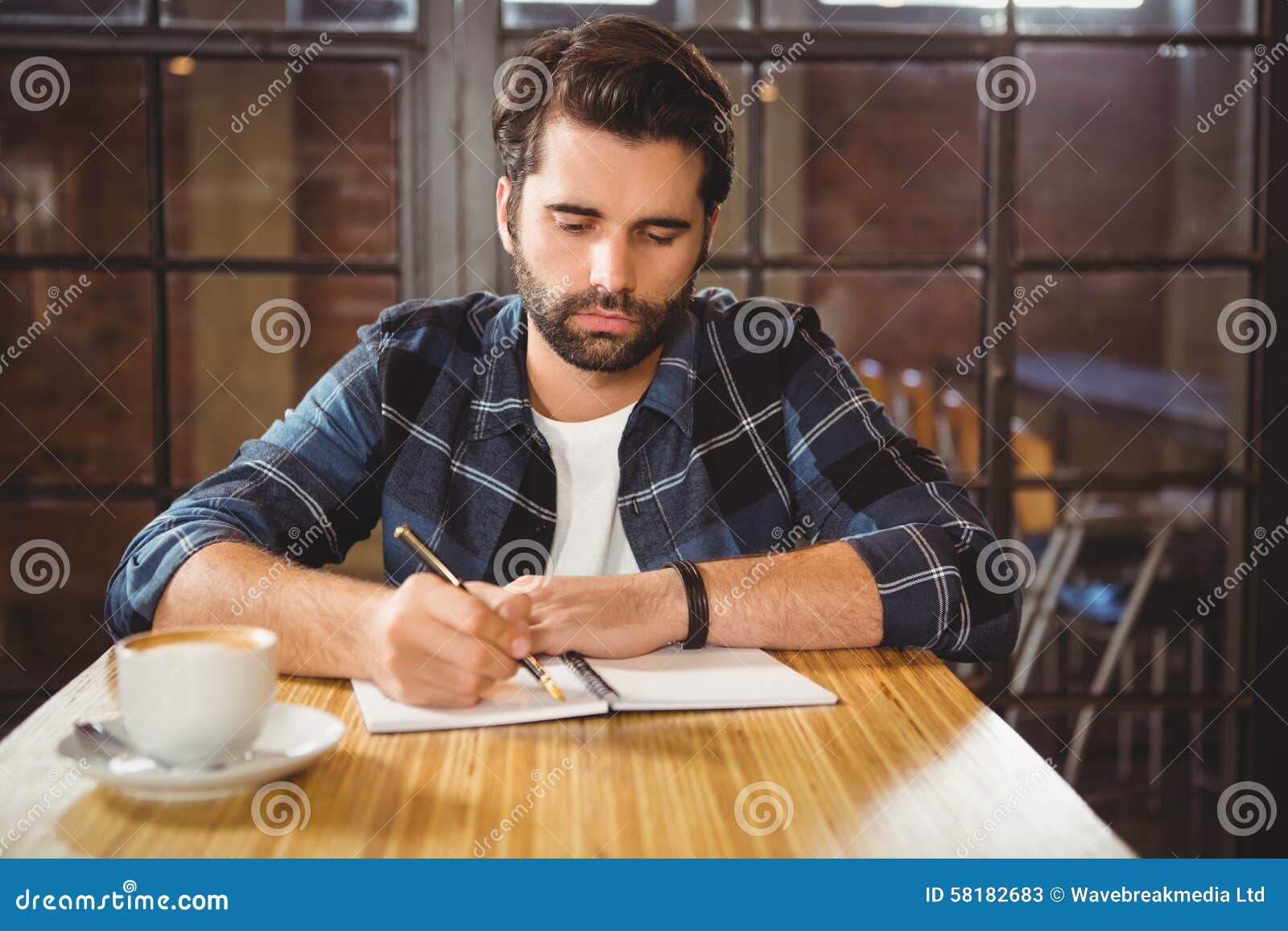 Young Man Taking Notes in His Notebook Stock Image - Image of leisure ...