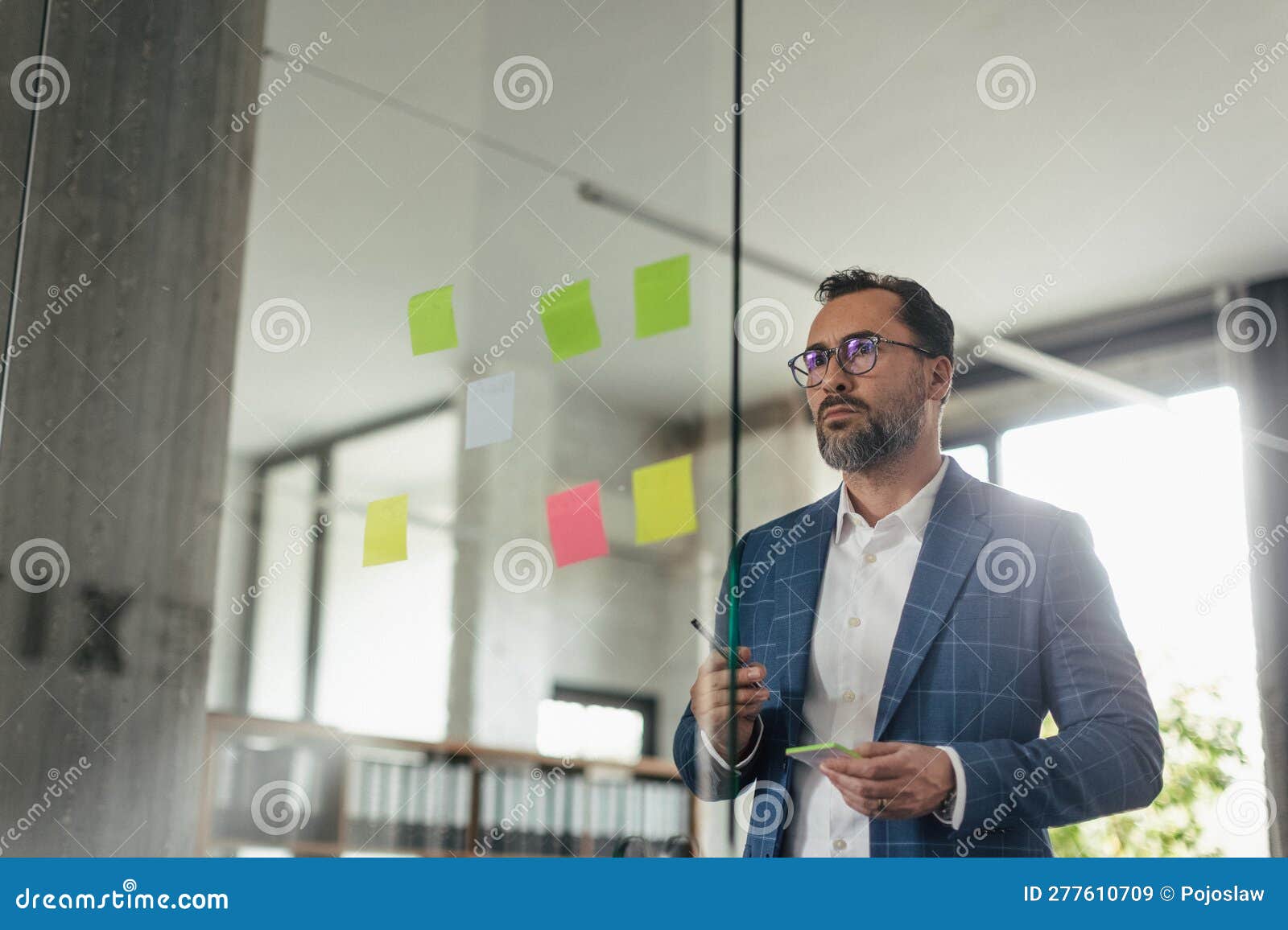 Young Man Taking Notes in His Office. Stock Image - Image of note ...