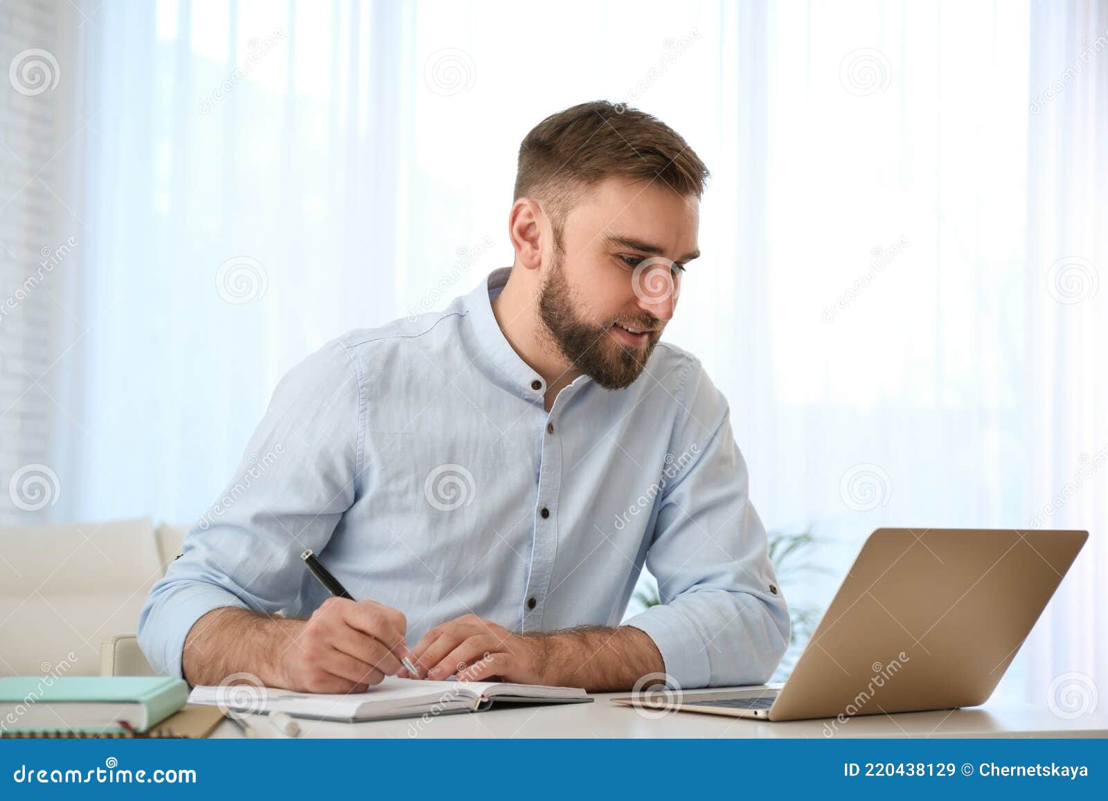Young Man Taking Notes during Online Webinar at Table Stock Image ...
