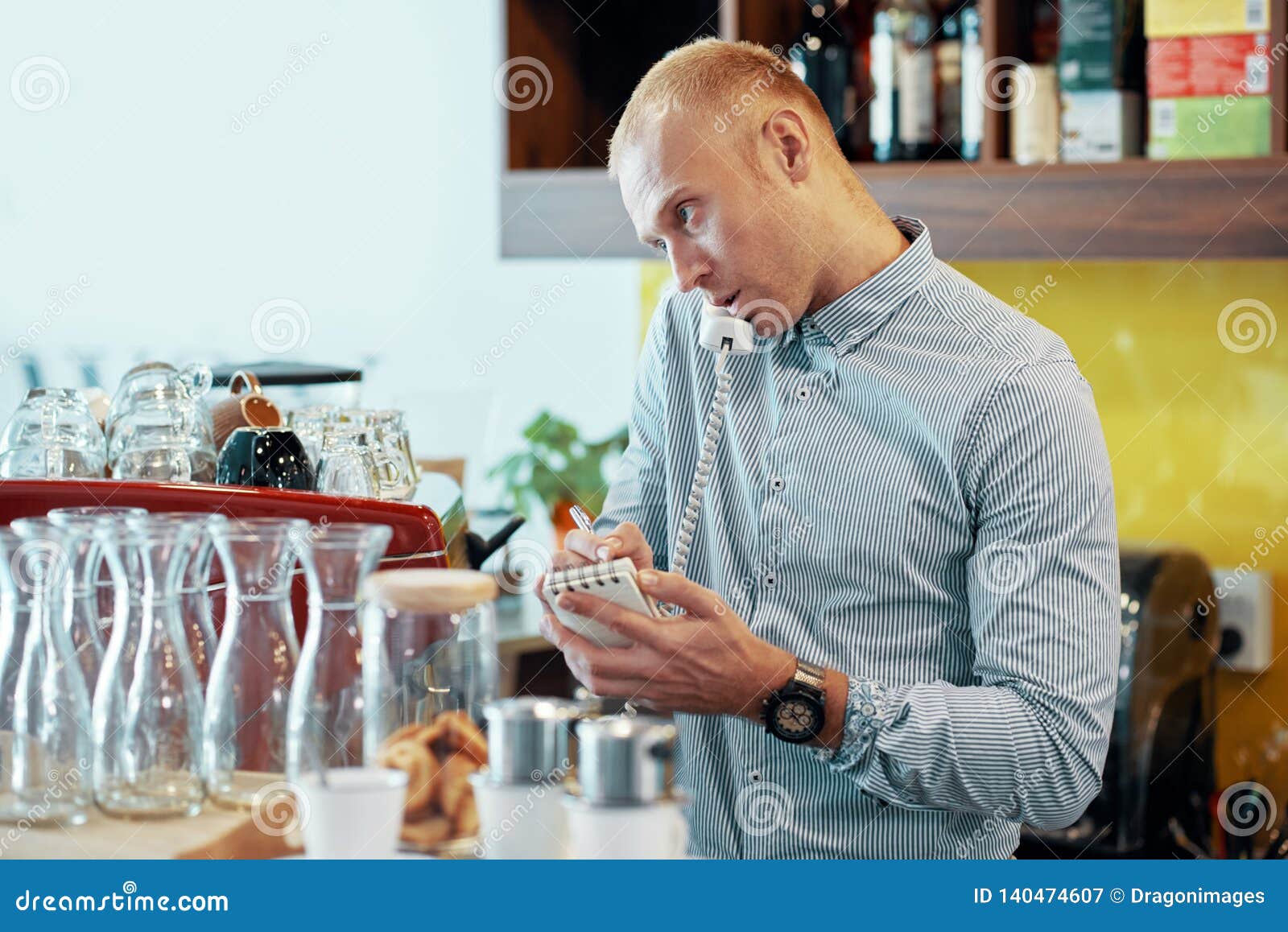 Young Man Taking Telephone Order in Cafeteria Stock Image - Image of ...
