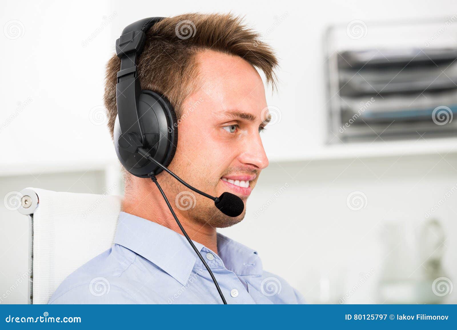 Young Man Talking on Headset at Office Stock Image - Image of ...