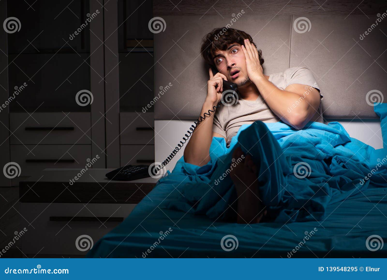 The Young Man Talking on Phone in Bed Stock Image - Image of online ...