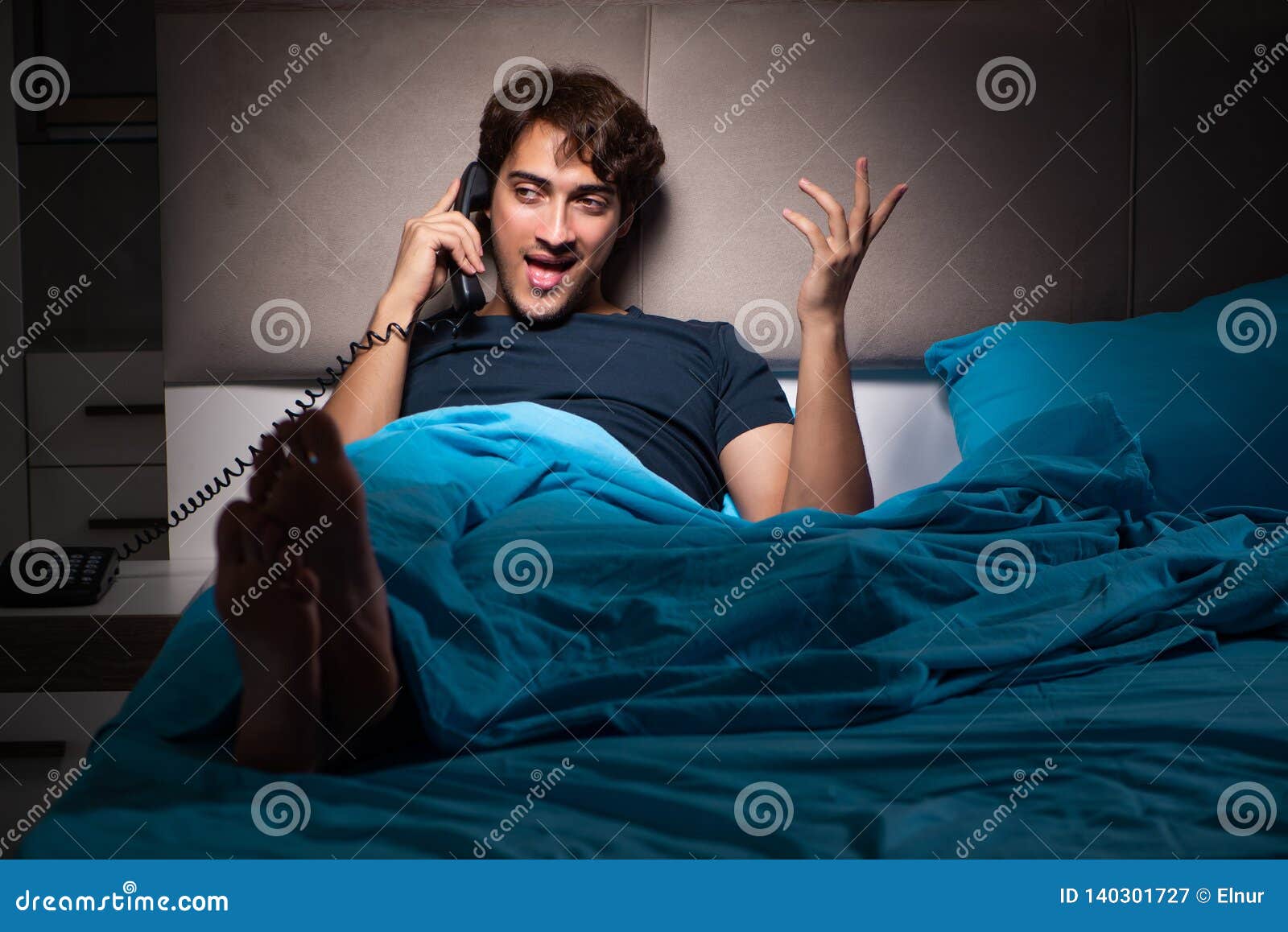 The Young Man Talking on Phone in Bed Stock Image - Image of home ...