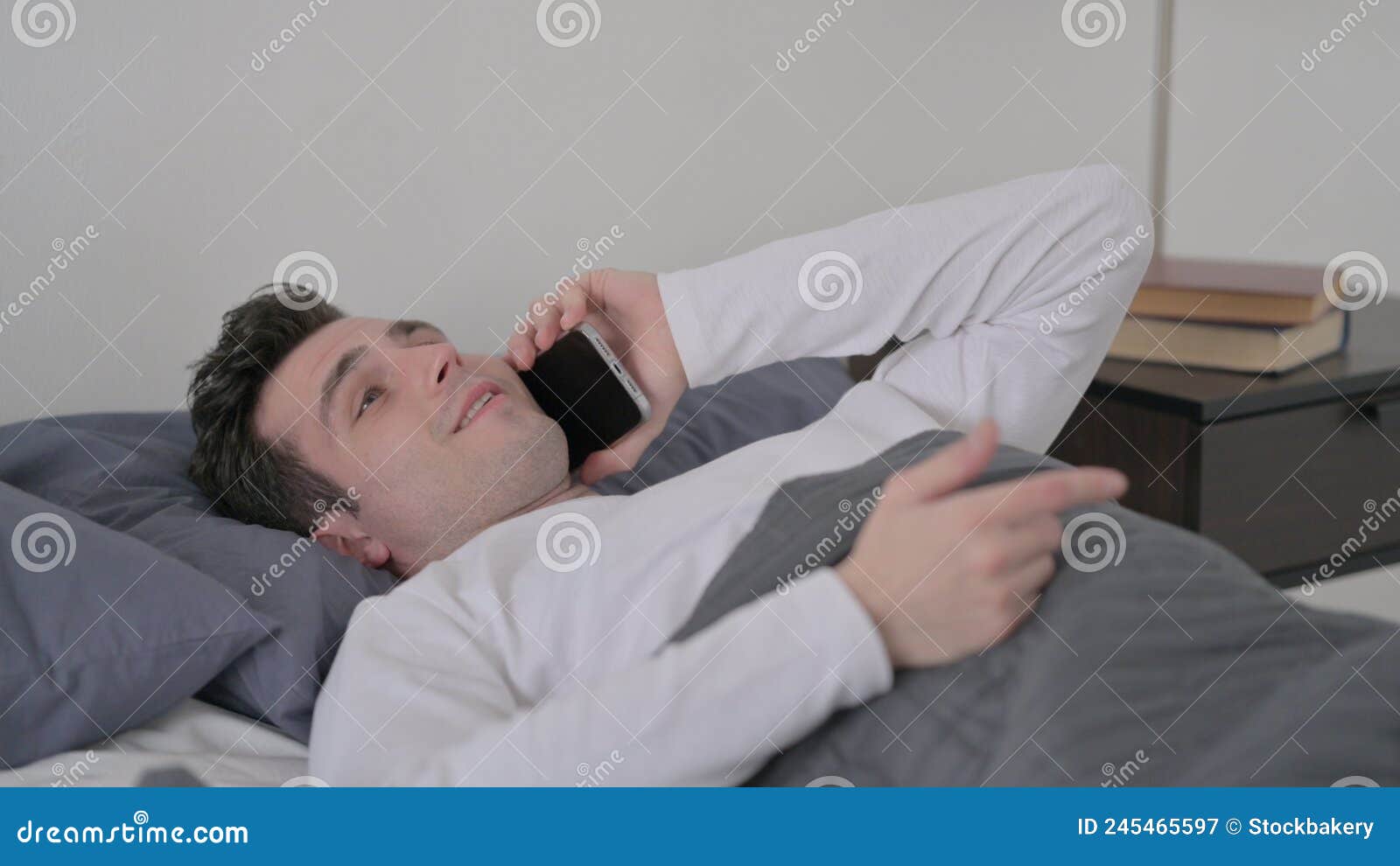 Man Talking on Phone while Sleeping in Bed Stock Image - Image of ...