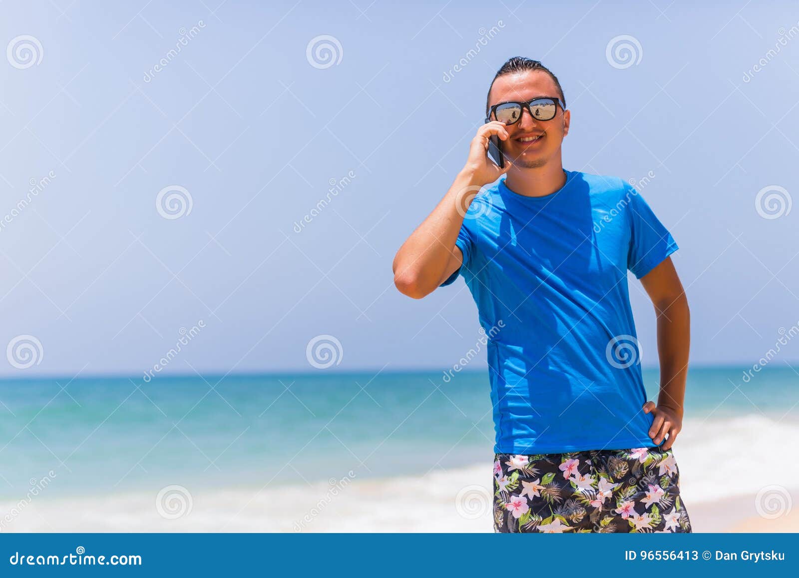 Young Man Talking on Telephone in the Beach Stock Image - Image of ...