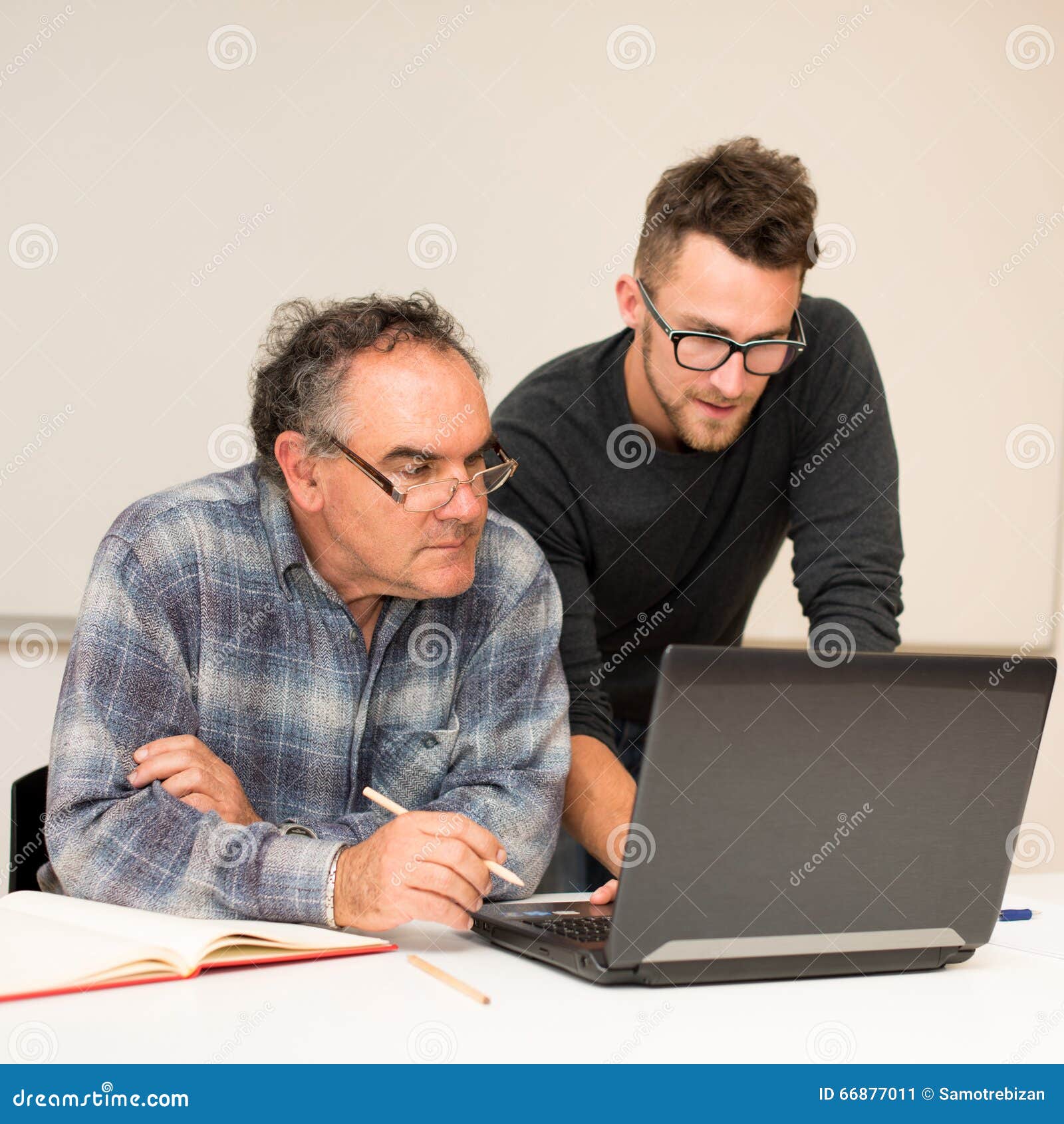 Young Man Teaching Eldery Man of Usage of Computer. Intergenerational ...