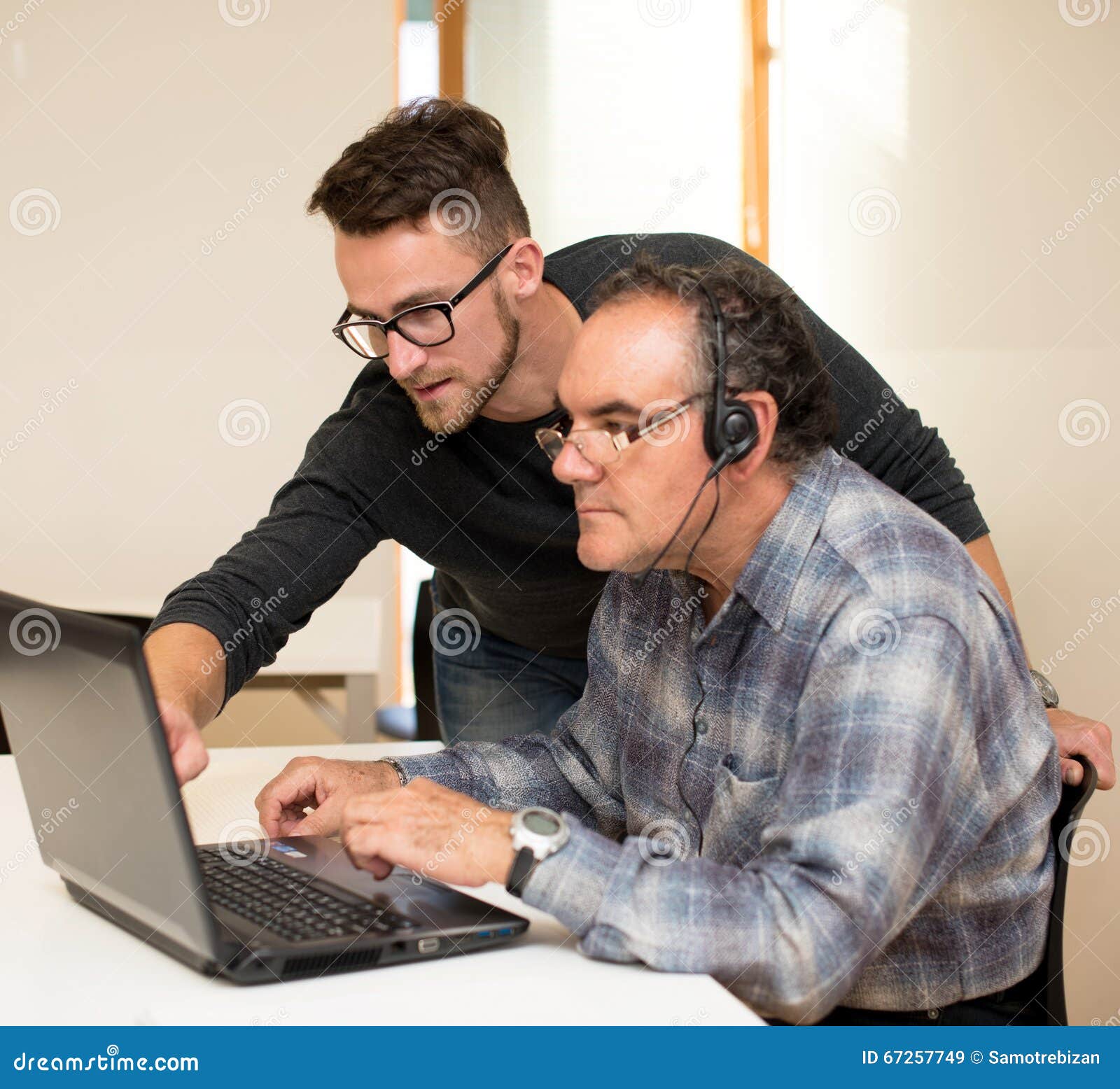 Young Man Teaching Eldery Man of Usage of Computer. Intergenerational ...
