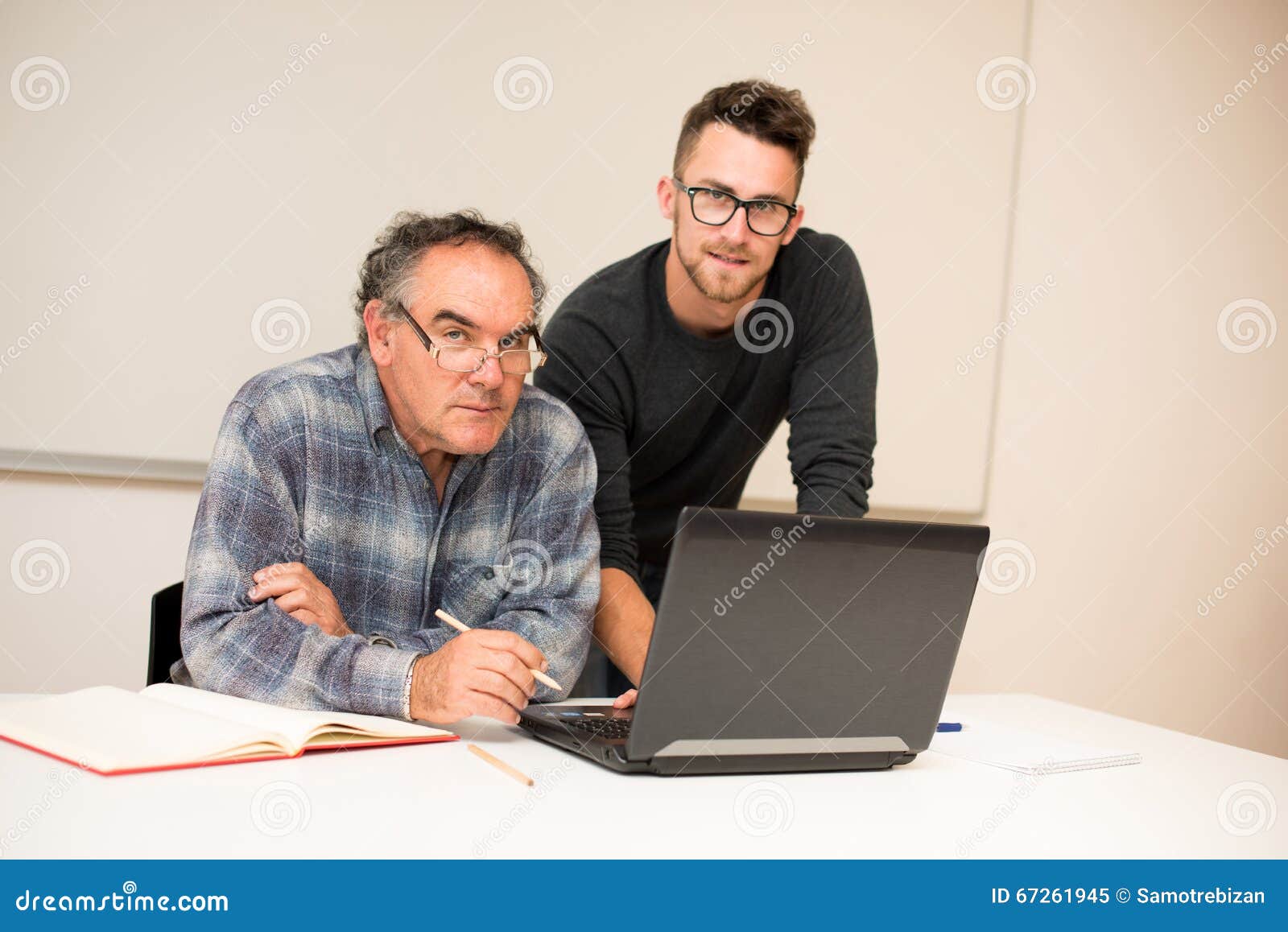 Young Man Teaching Eldery Man of Usage of Computer. Intergenerational ...