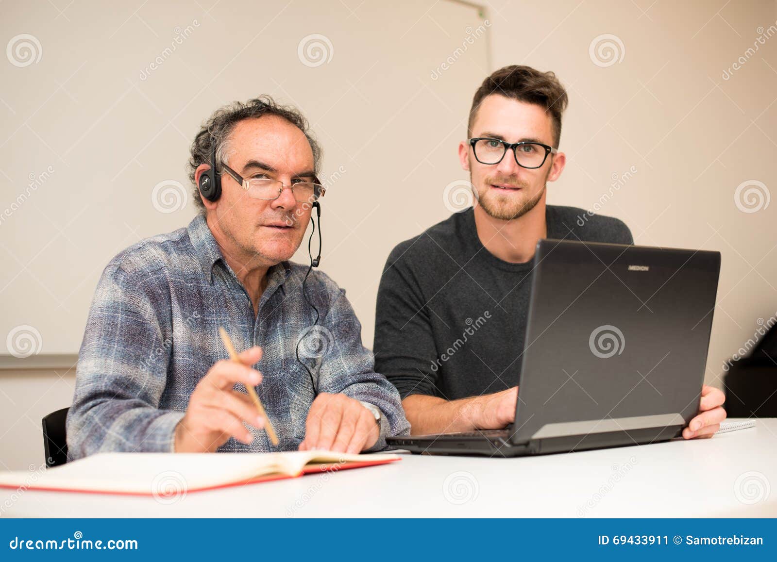 Young Man Teaching Eldery Man of Usage of Computer. Intergenerational ...