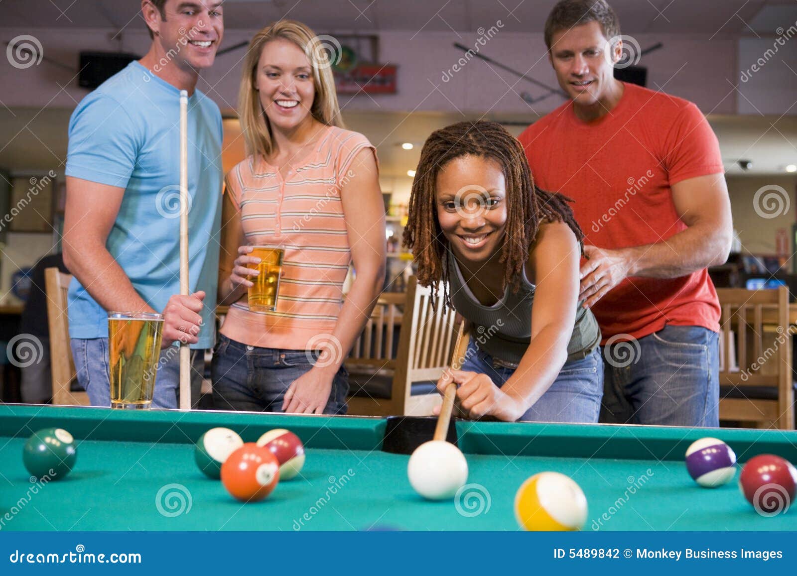 Young Man Teaching a Young Woman To Play Pool Stock Photo - Image of ...