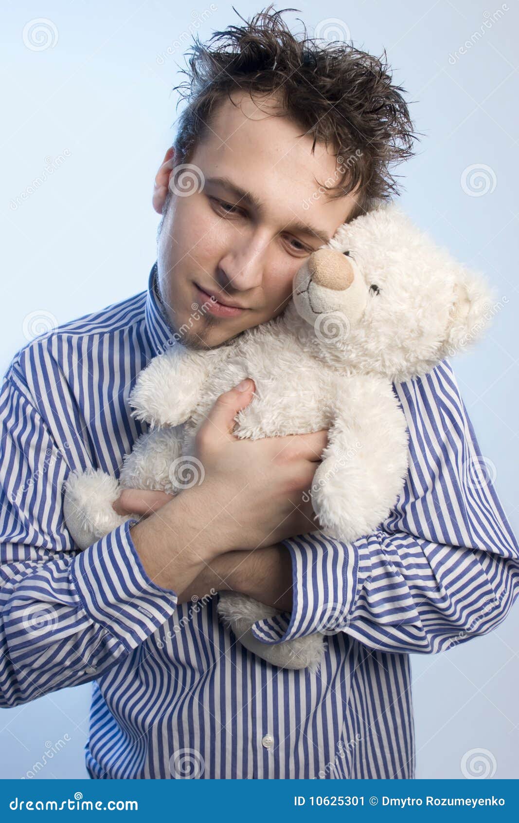 Young man with a teddy stock image. Image of cheerful - 10625301