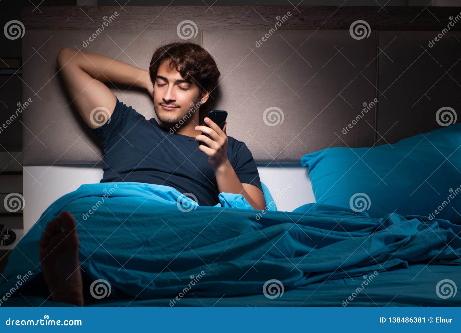 The Young Man Texting on Mobile Late at Night Stock Image - Image of ...
