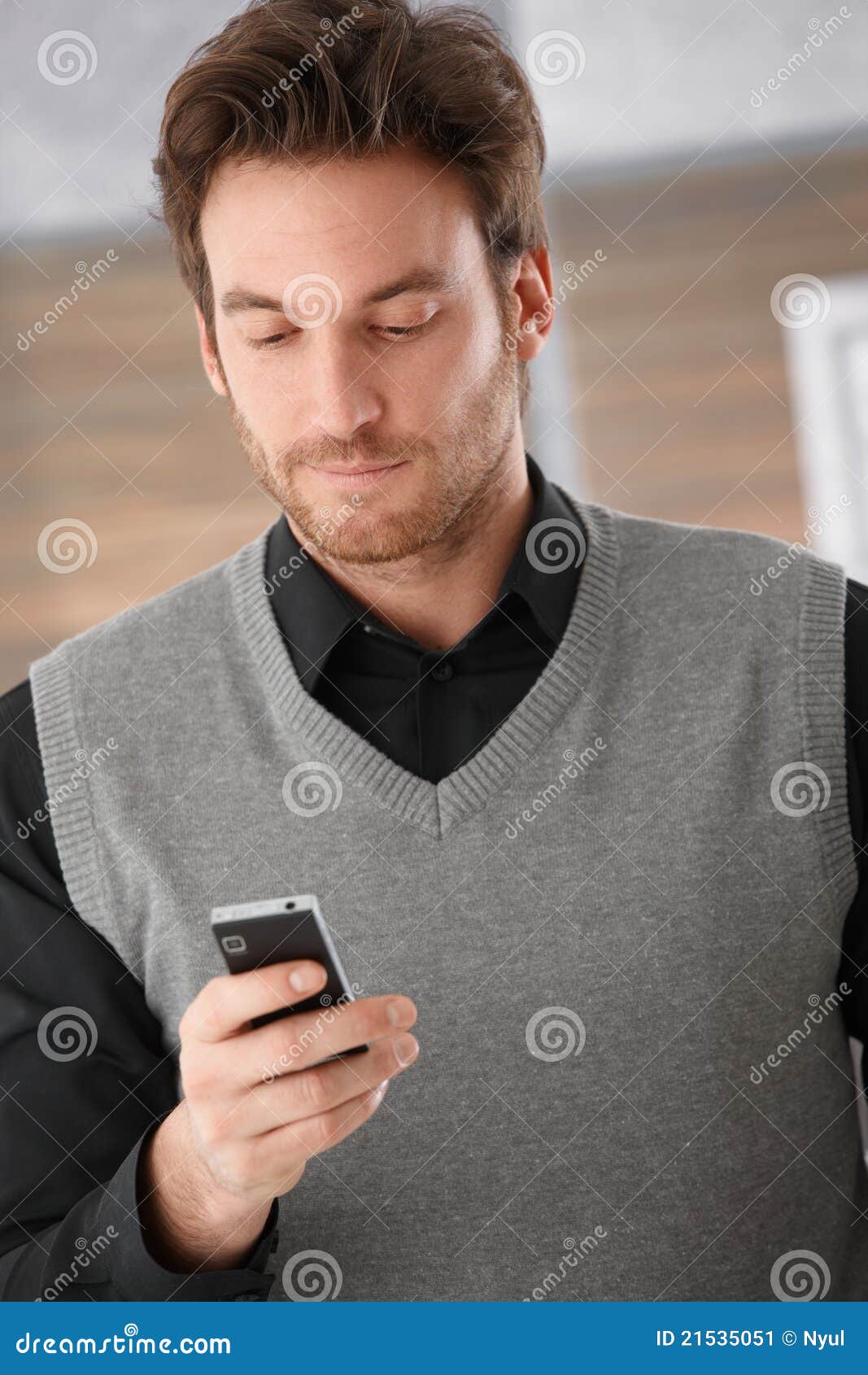 Young Man Texting on Mobile Phone Stock Image - Image of concentration ...