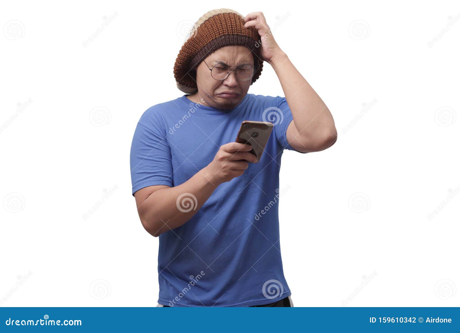 Young Man Texting Reading Chatting on His Phone, Confused Expression ... Young Man Texting Reading Chatting on His Phone, Confused Expression ...