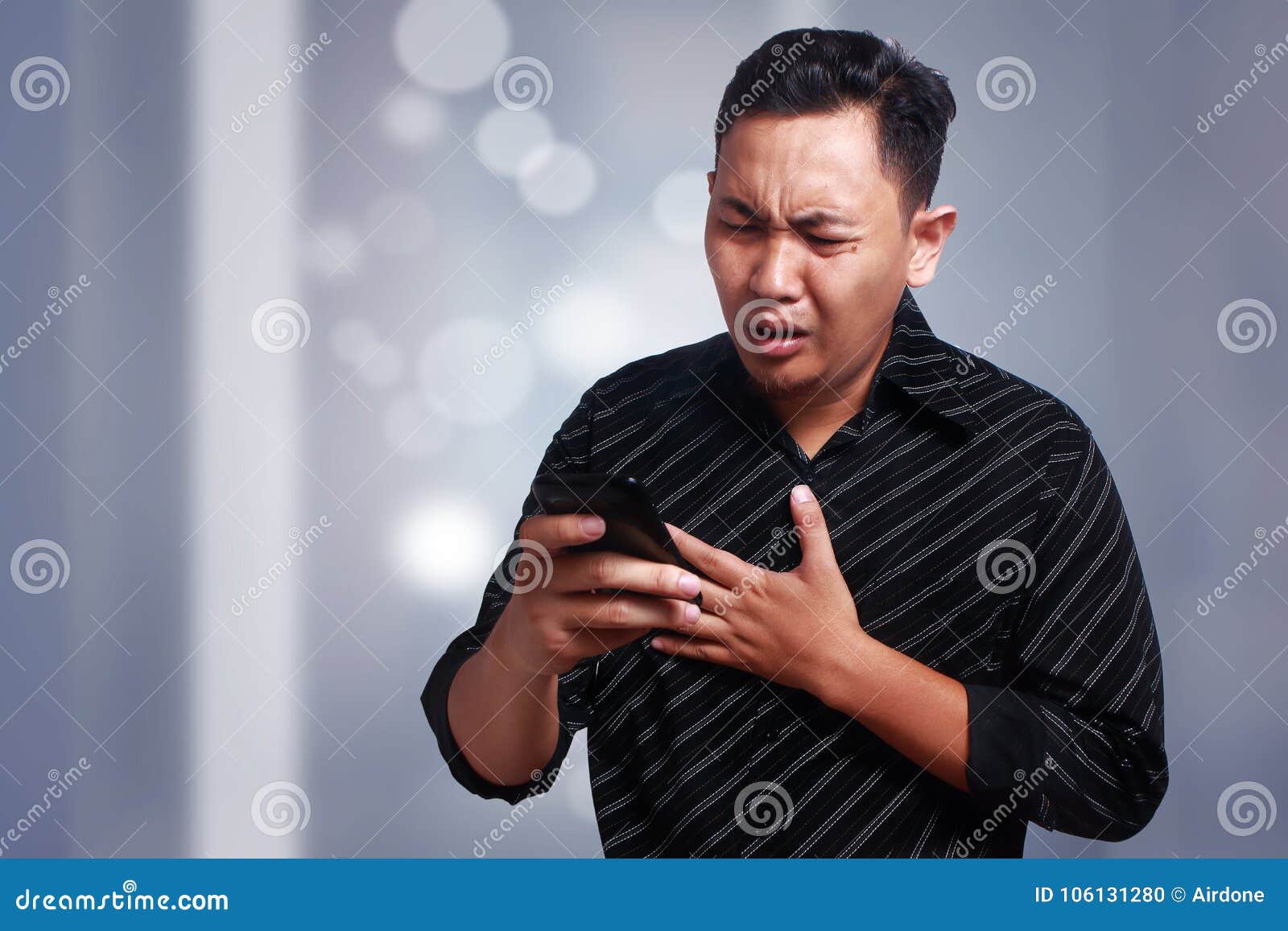 Young Man Texting Reading Chatting on His Phone Sad Crying Stock Photo ... Young Man Texting Reading Chatting on His Phone Sad Crying Stock Photo ...