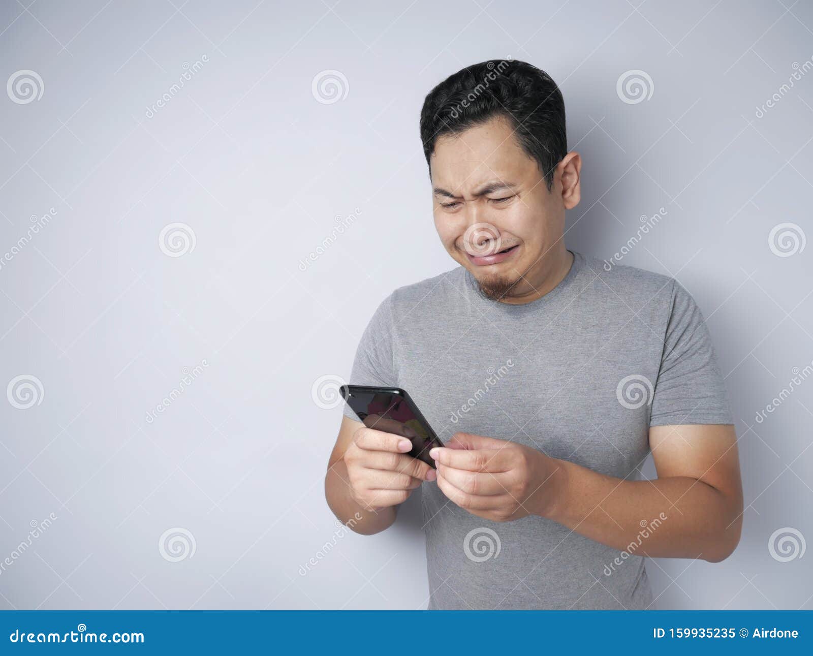 Young Man Texting Reading Chatting on His Phone Sad Crying Stock Image ... Young Man Texting Reading Chatting on His Phone Sad Crying Stock Image ...