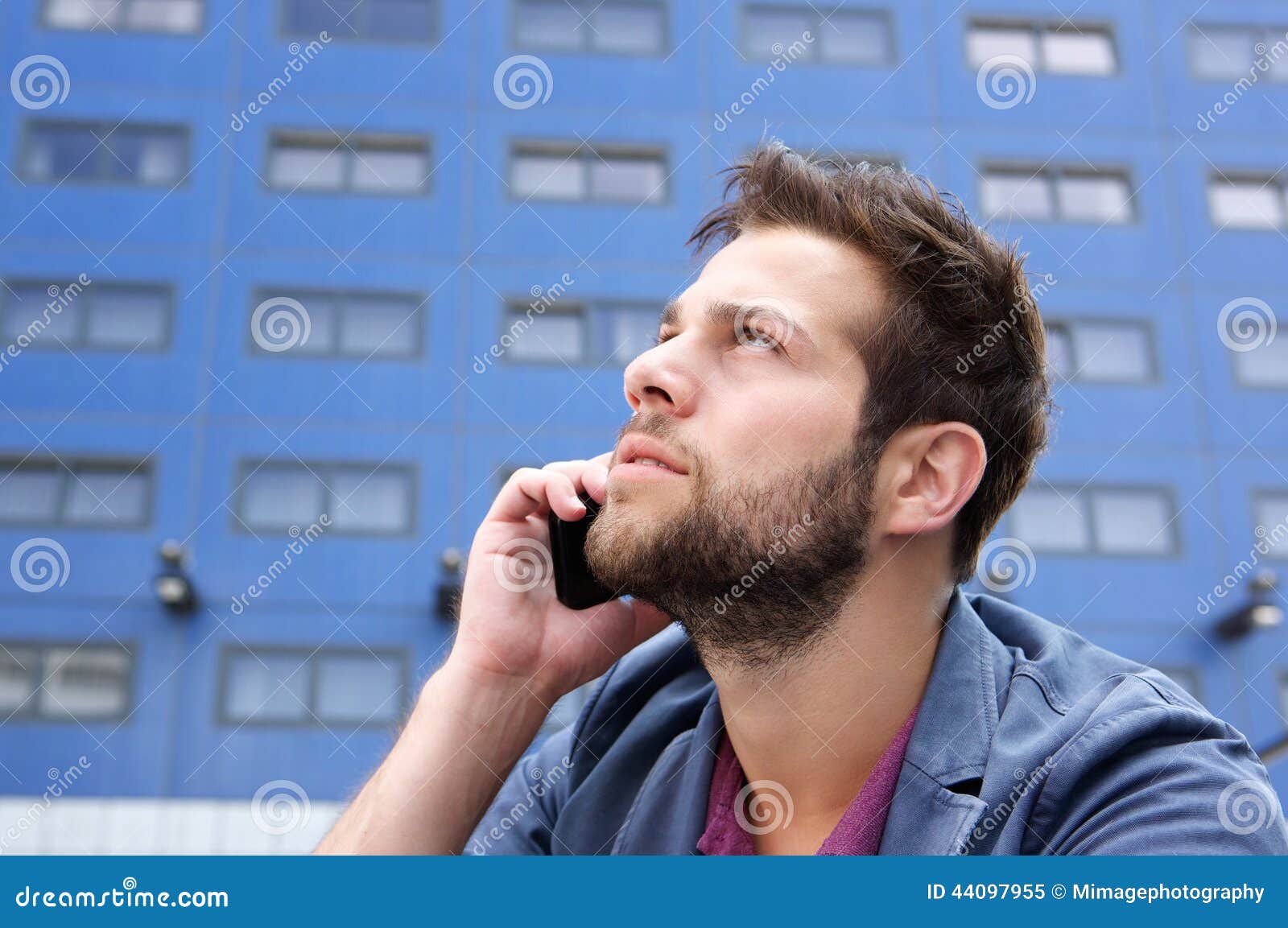 Young Man Thinking with Mobile Phone Stock Image - Image of cute, model ...