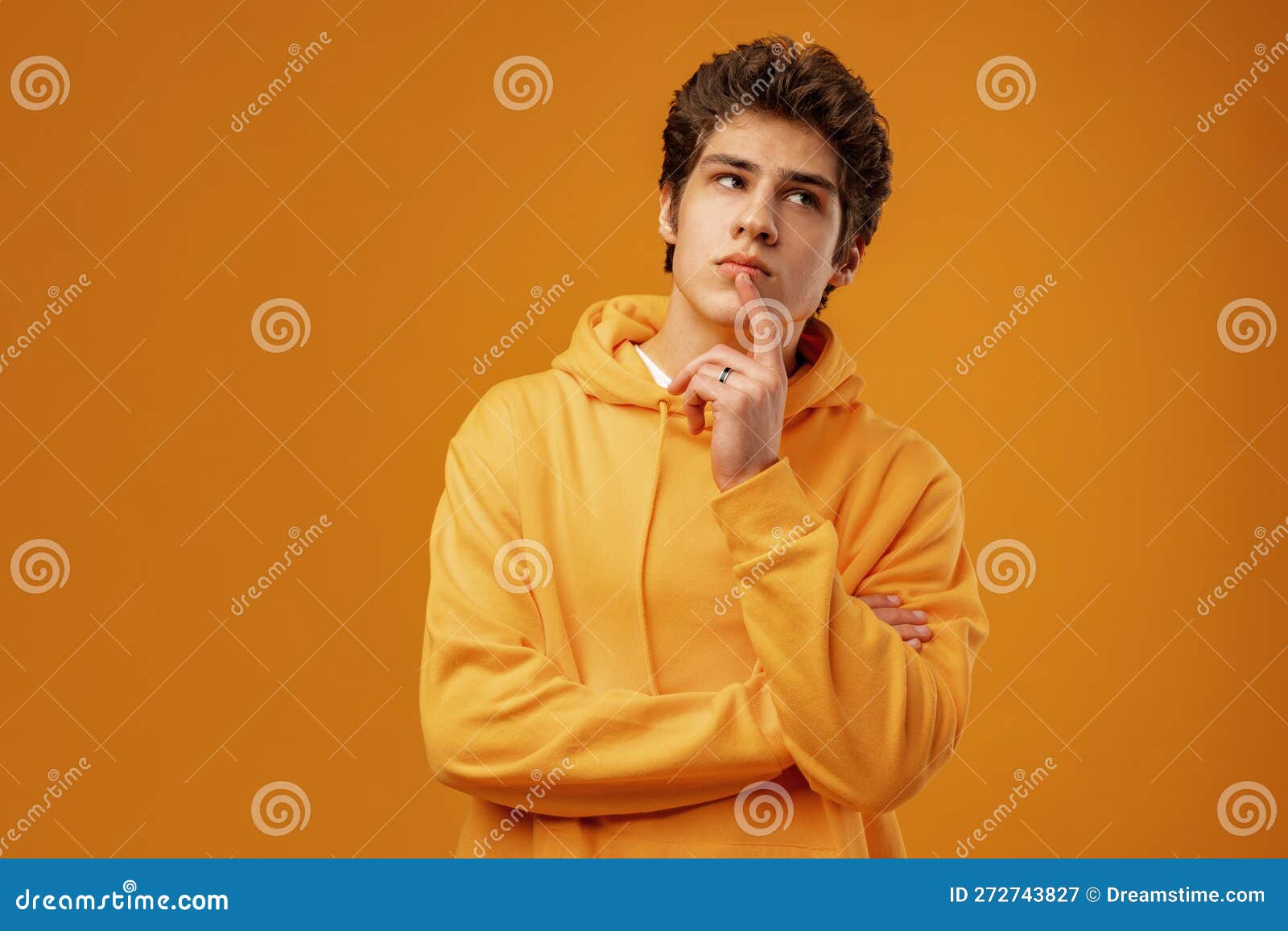 Young Man Thinking about Things on Yellow Background Stock Image ...