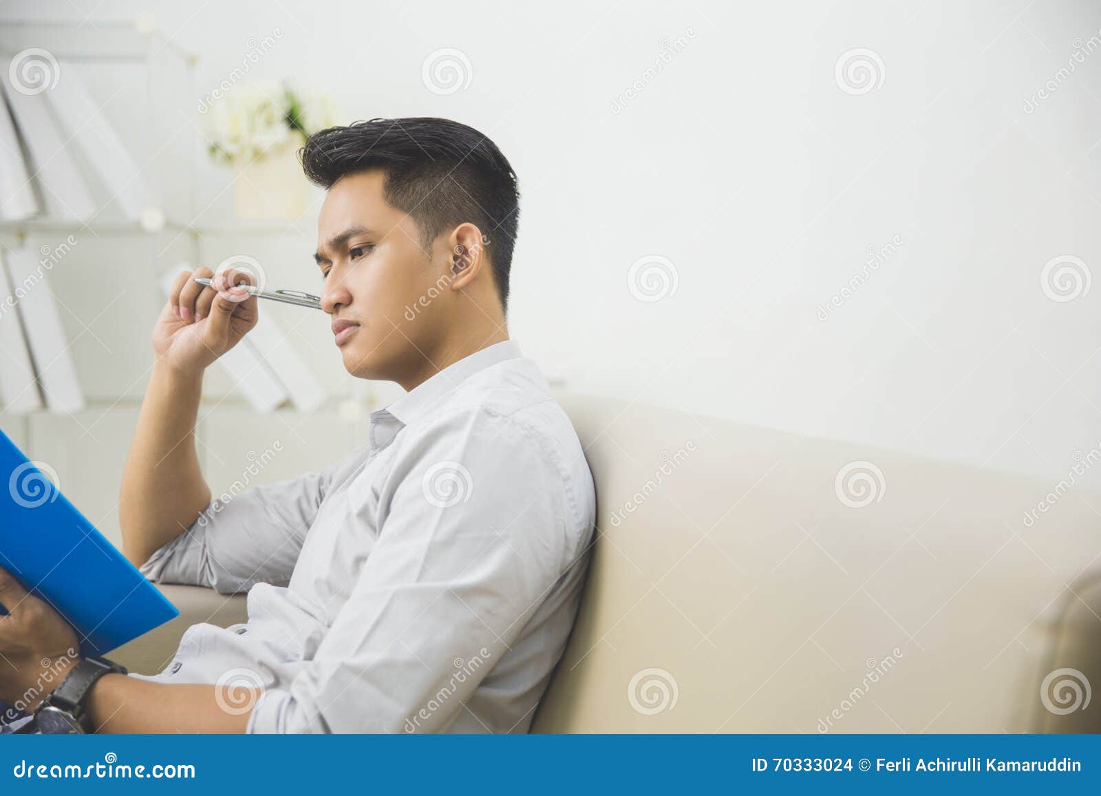 Young Man Thinking while Writing on a Book Stock Photo - Image of test ...