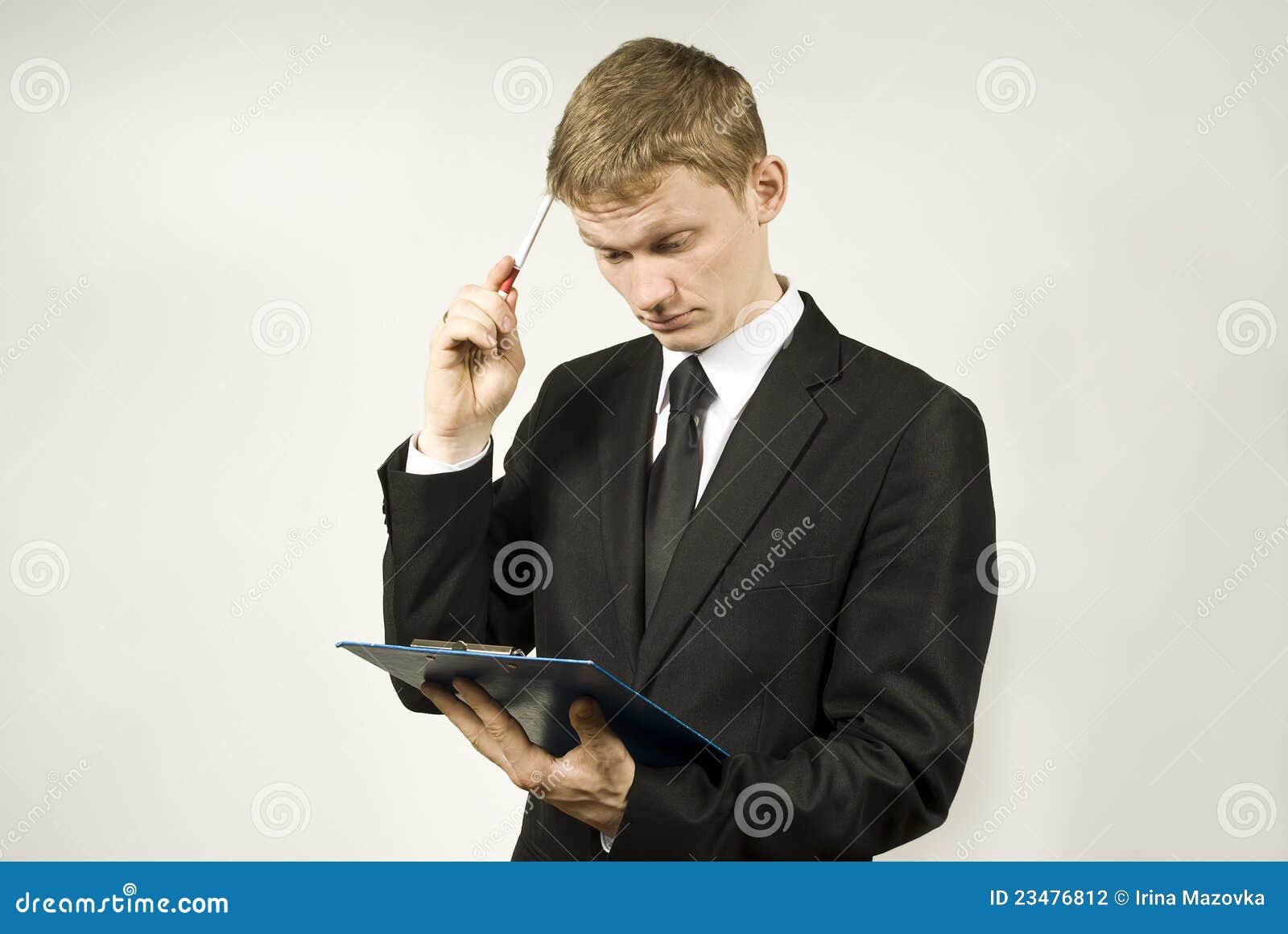 A Young Man Thoughtfully Looking at the Plan Stock Photo - Image of ...
