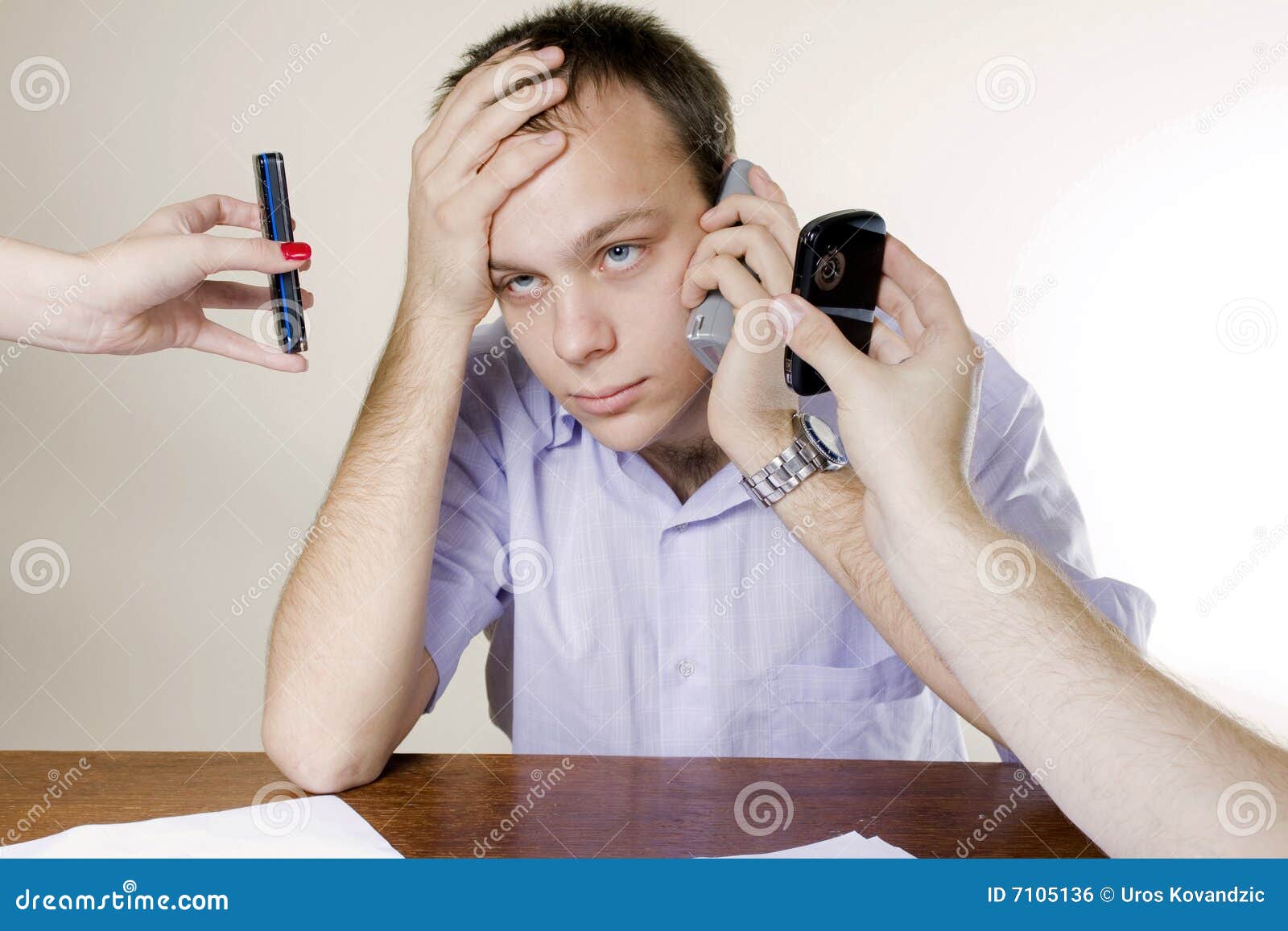 Young Man with Three Cellphones Stock Photo - Image of handsome, hard ...