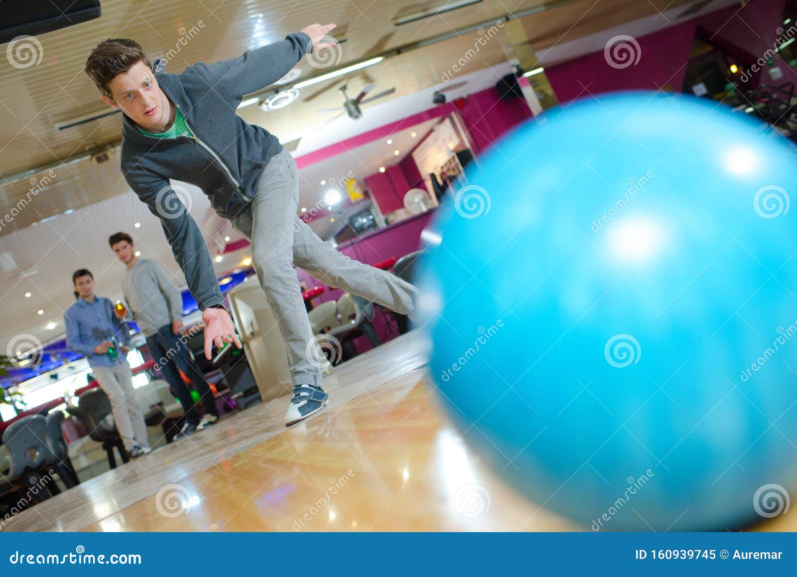 Young Man Throwing Bowling Ball Stock Image - Image of smack, alley ...