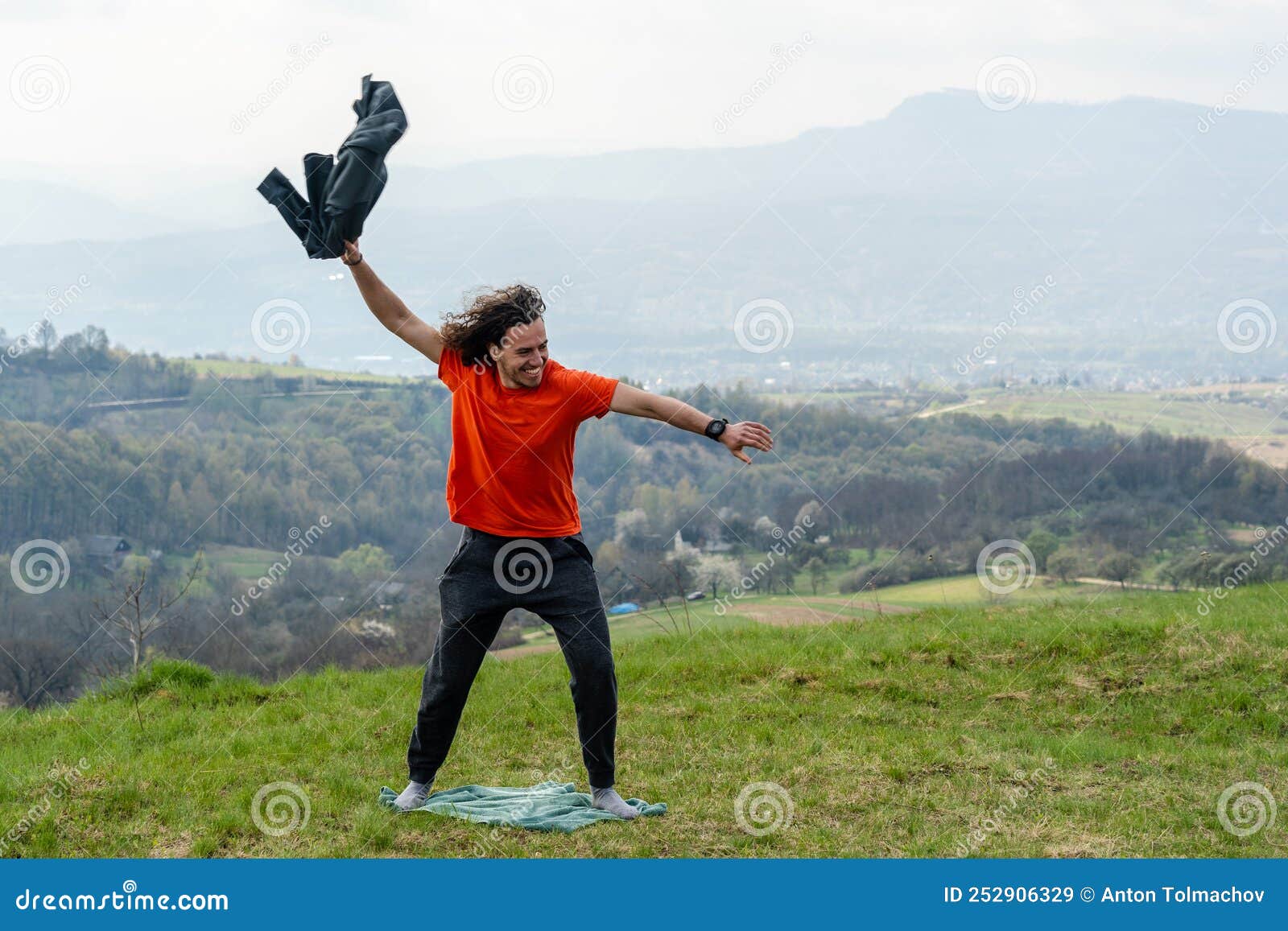Young Man Throwing a Jacket in the Air on Mountain Stock Image - Image ...