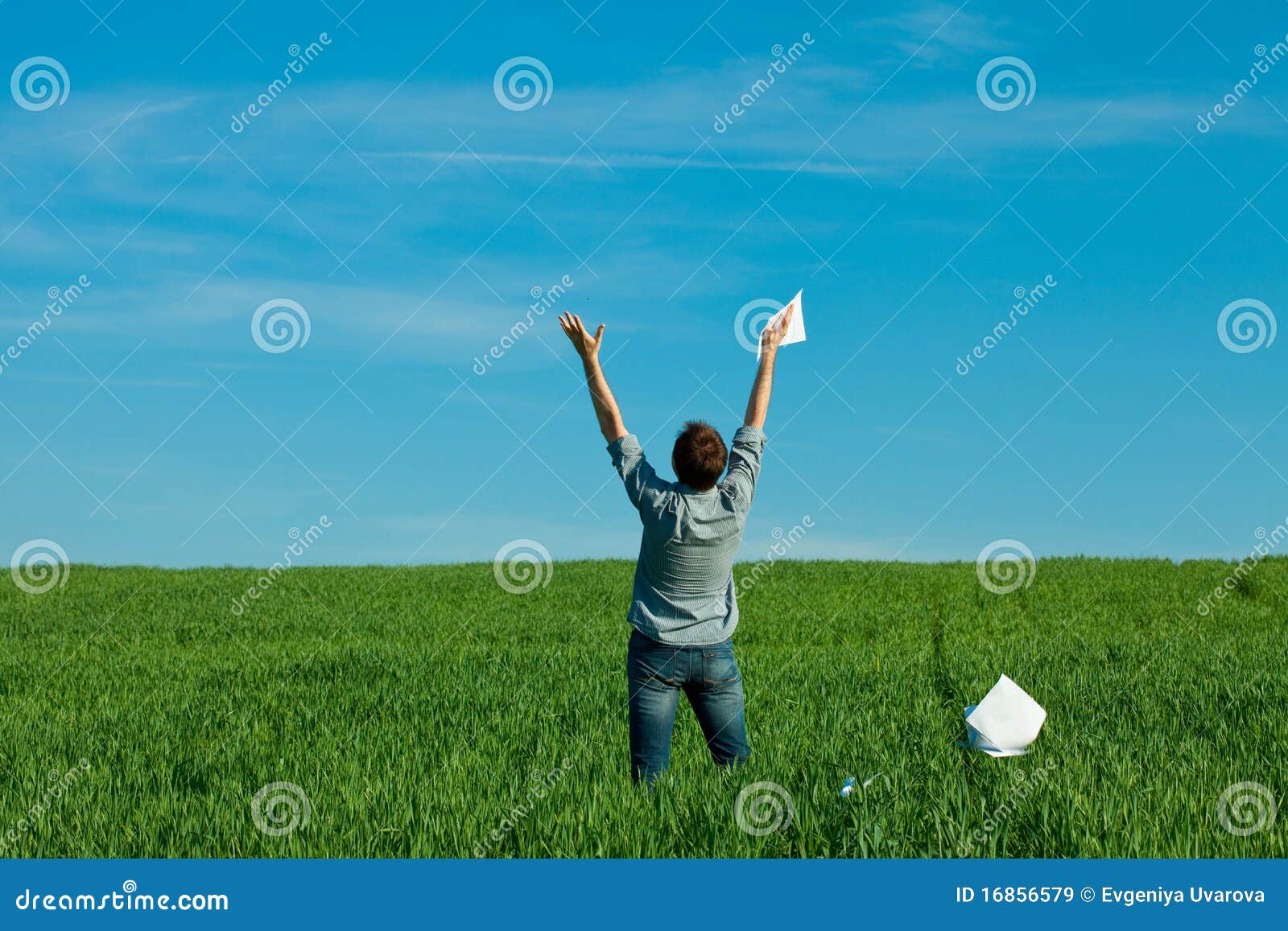 Young man throwing a paper stock image. Image of person - 16856579