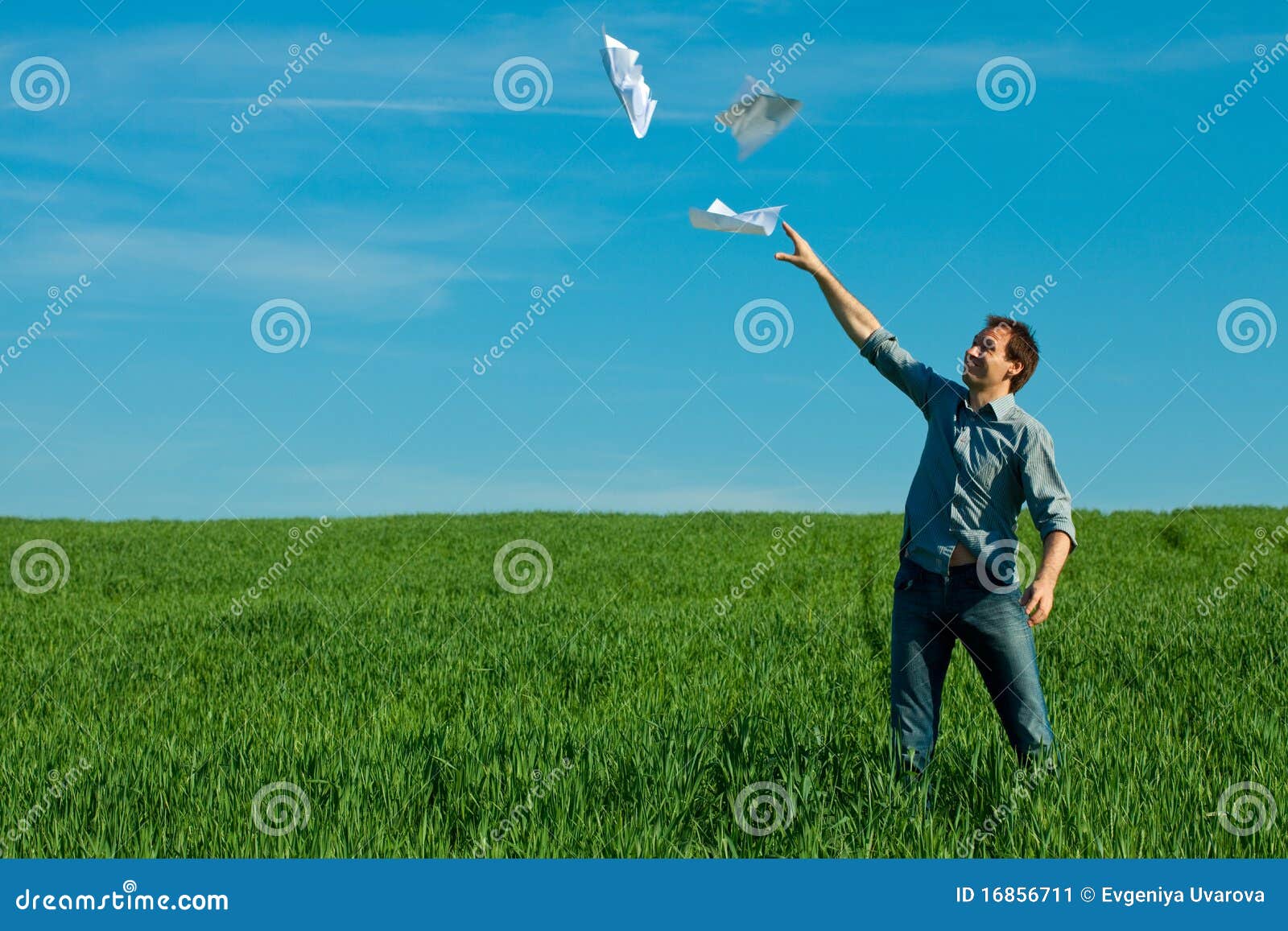 Young man throwing a paper stock image. Image of arms - 16856711