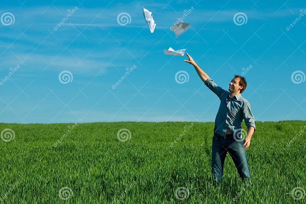 Young man throwing a paper stock image. Image of arms - 16856711