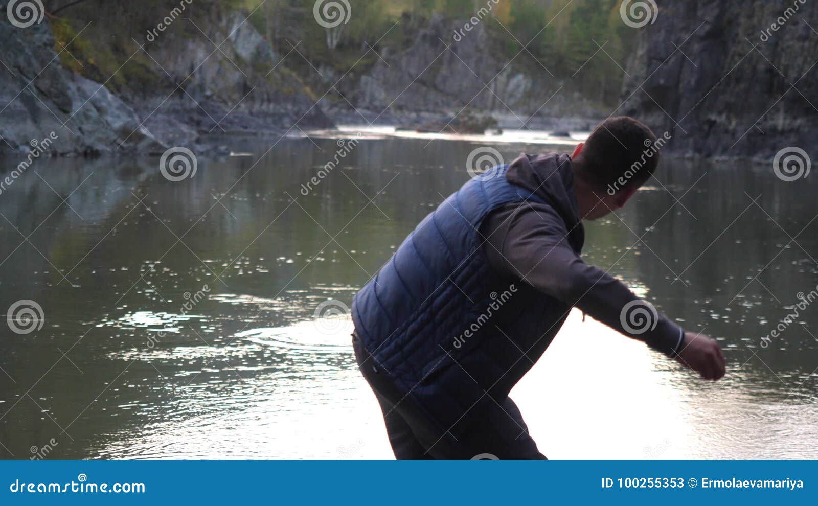 Young Man Throwing Stones in the Mountain River Stock Image - Image of ...