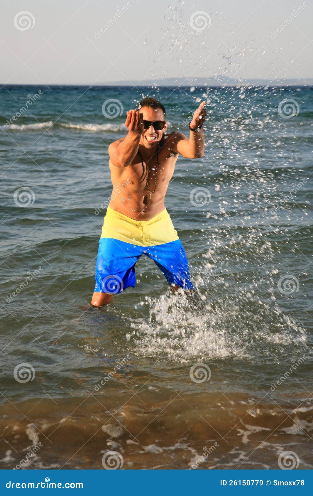 Young man throwing water stock image. Image of travel - 26150779
