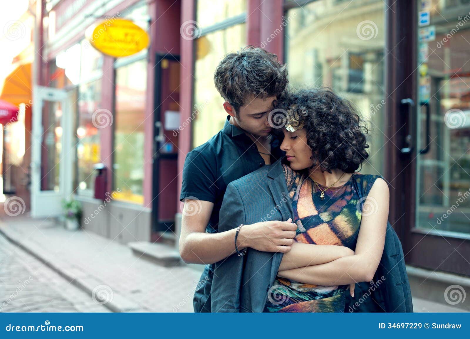 Young Man Throws His Jacket Over His Girlfriend Stock Image Image Of