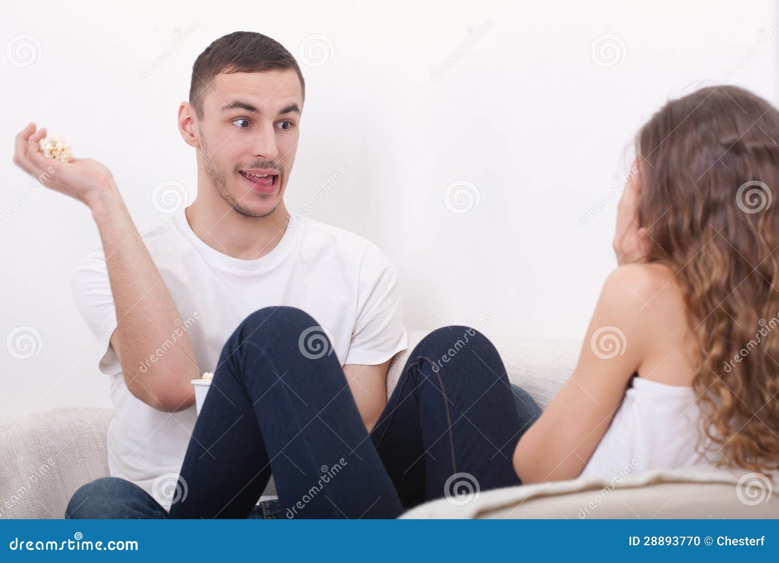 Young Man Throws Popcorn To His Girlfriend Stock Photo - Image of ...