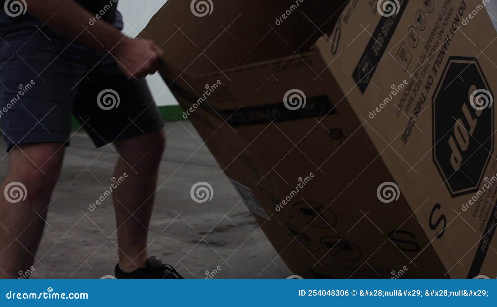 Young Man Tilts Heavy Box Upright Stock Footage - Video of house ...