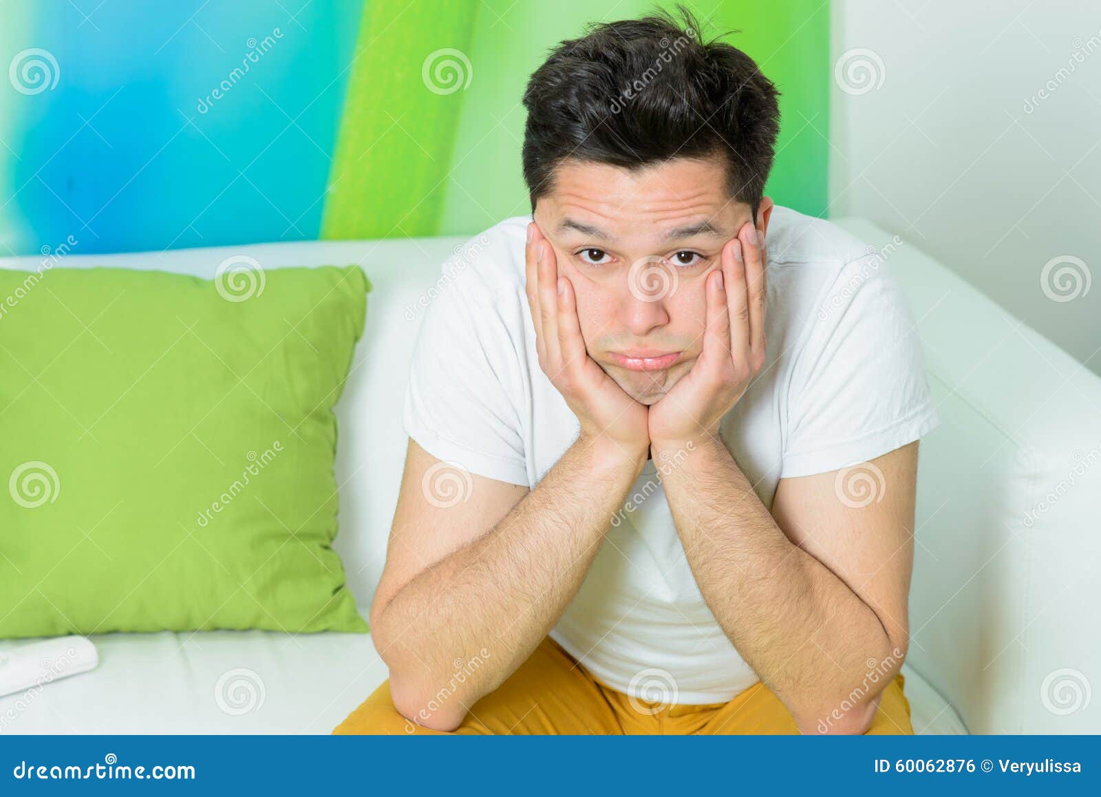 Young Man Tired Sitting at Sofa Stock Photo - Image of sitting, male ...