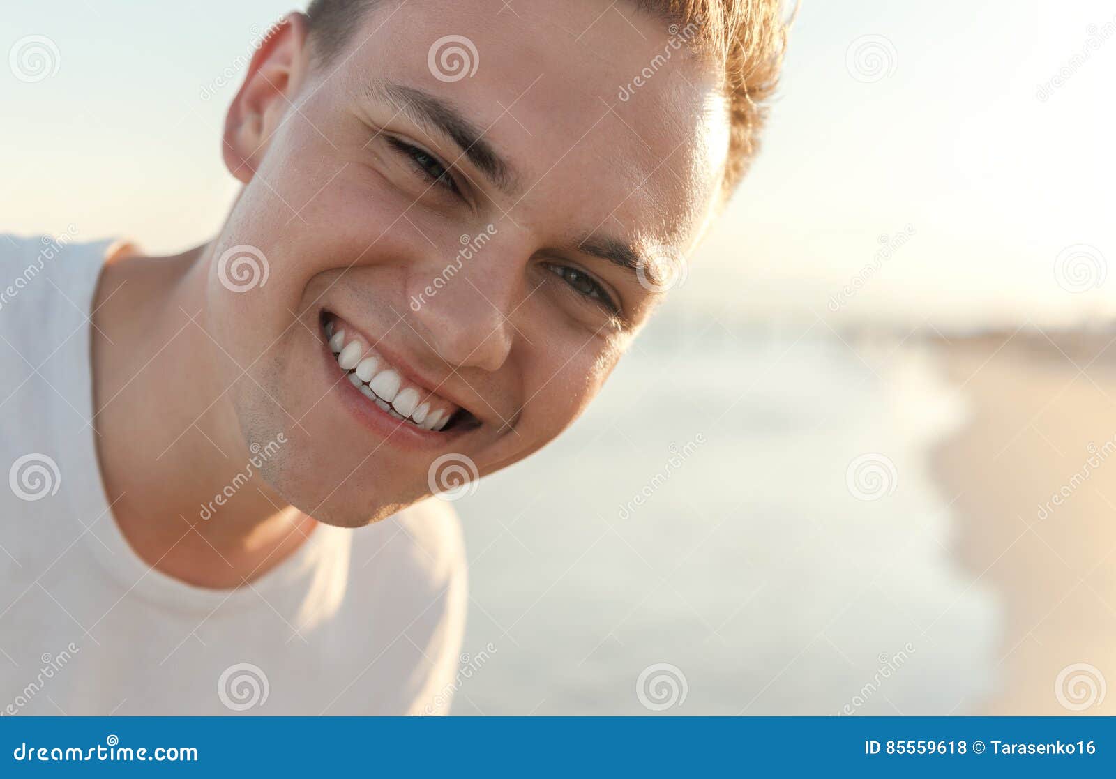 Young man to peep at... stock photo. Image of beach, effect - 85559618