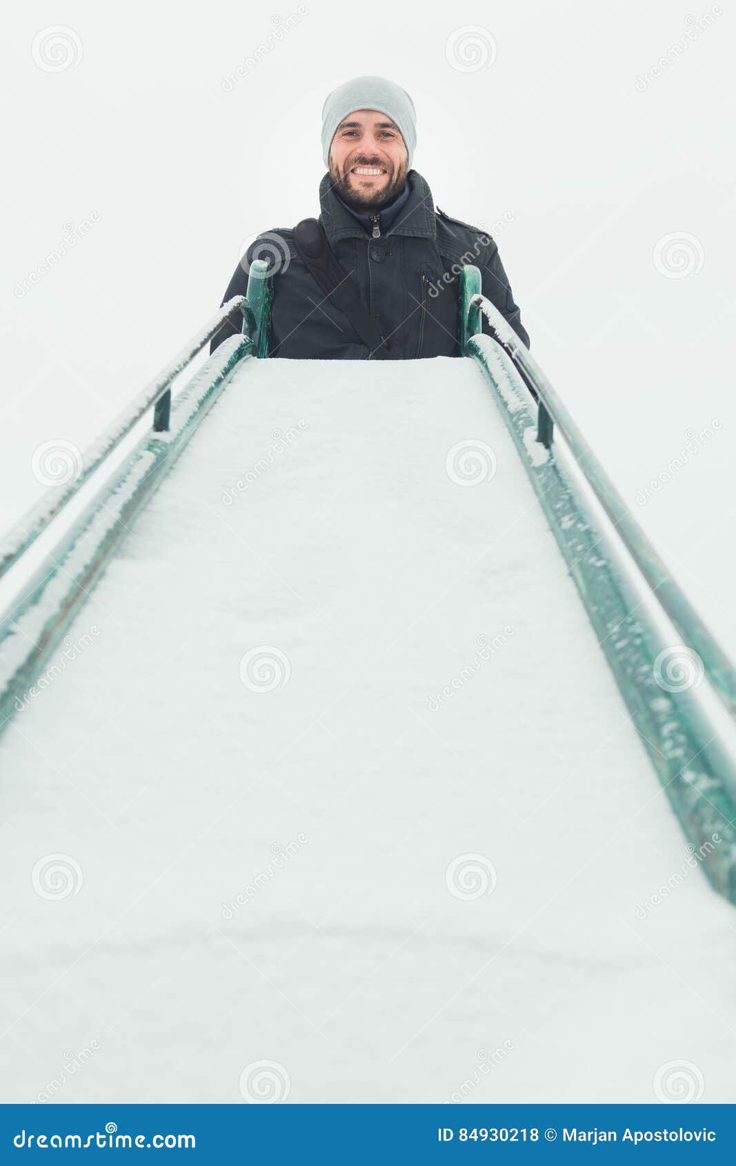 Young Man at the Top of the Slide in the Playground Stock Photo - Image ...