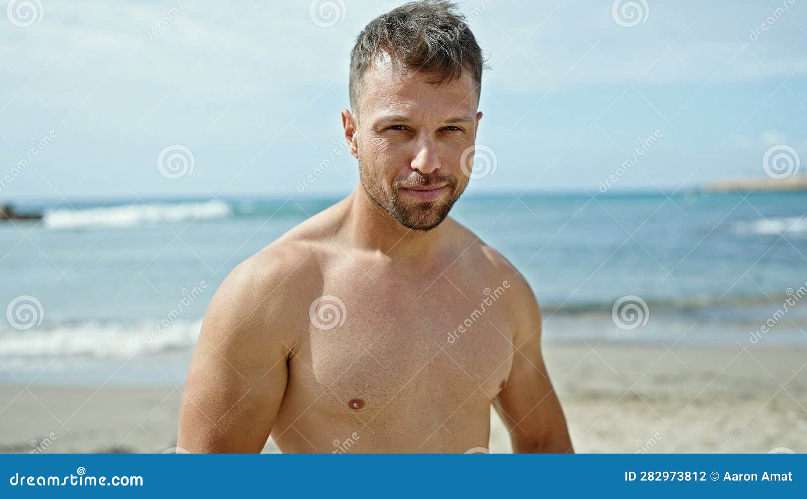 Young Man Tourist Smiling Confident Standing at the Beach Stock Photo ...