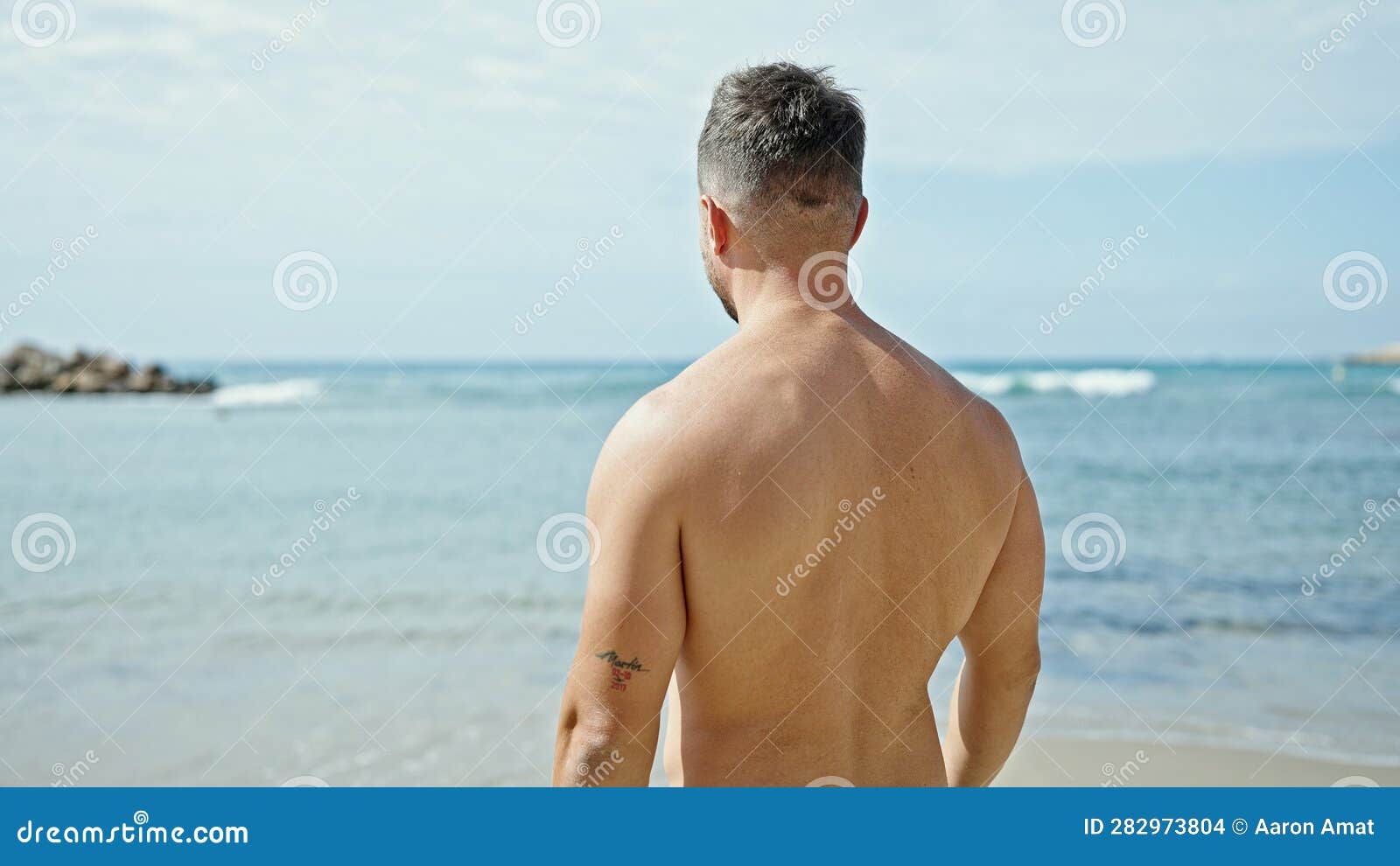 Young Man Tourist Standing Backwards Looking Around at the Beach Stock ...